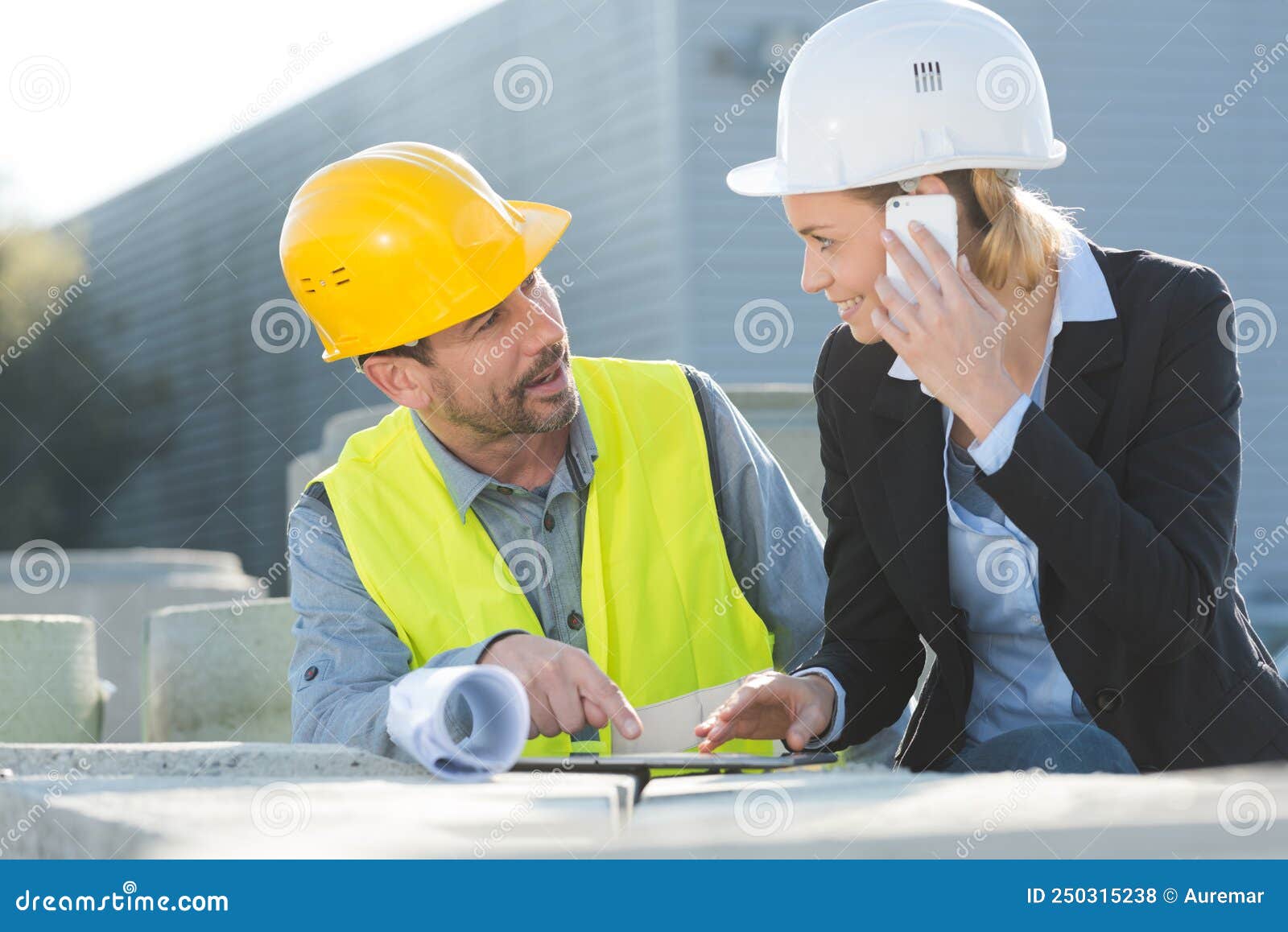 Two Workers Working Outside on Construction Site Stock Photo - Image of ...