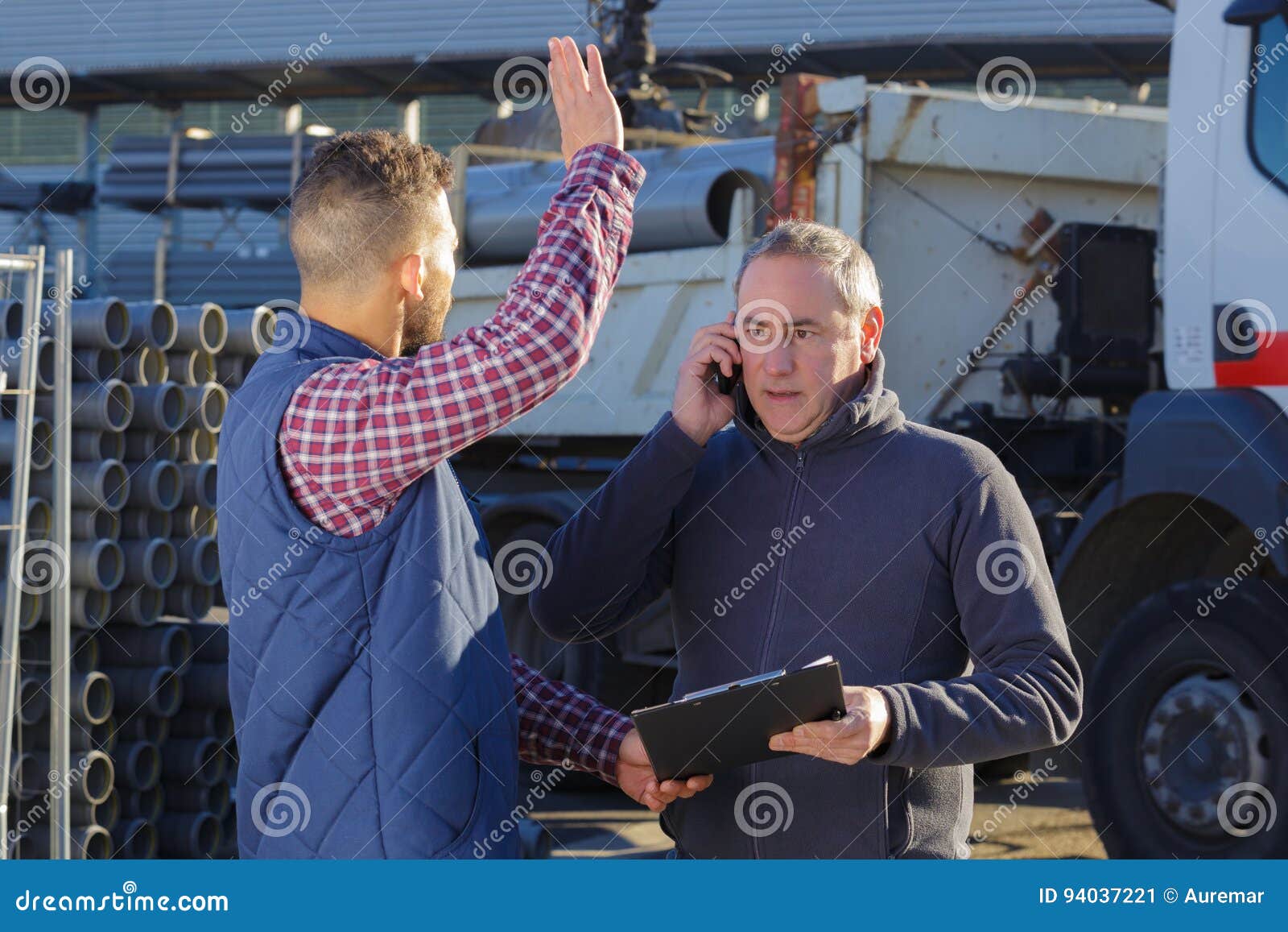 Two Workers Working Outside on Construction Site Stock Image - Image of ...