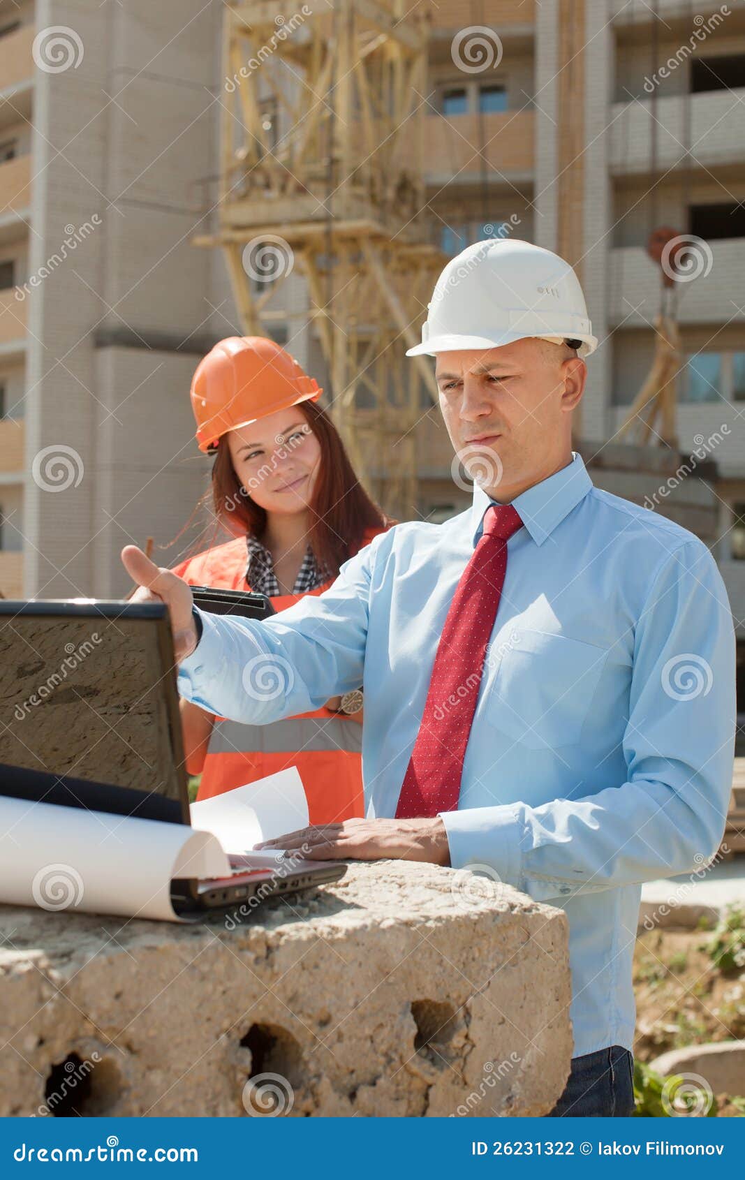 Two Workers Works on the Building Site Stock Photo - Image of hardhat ...