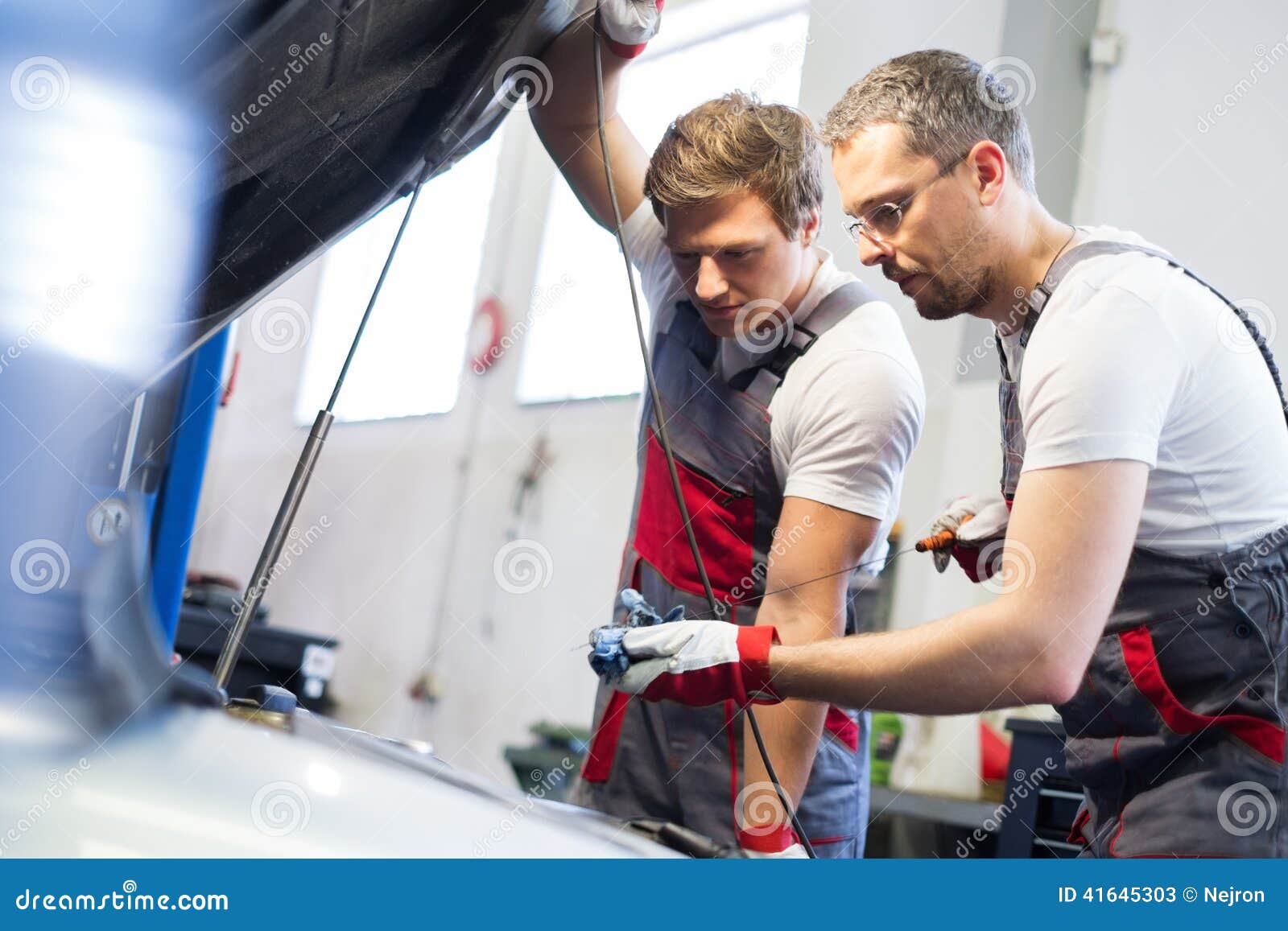 Two workers in a workshop stock image. Image of repairing - 41645303