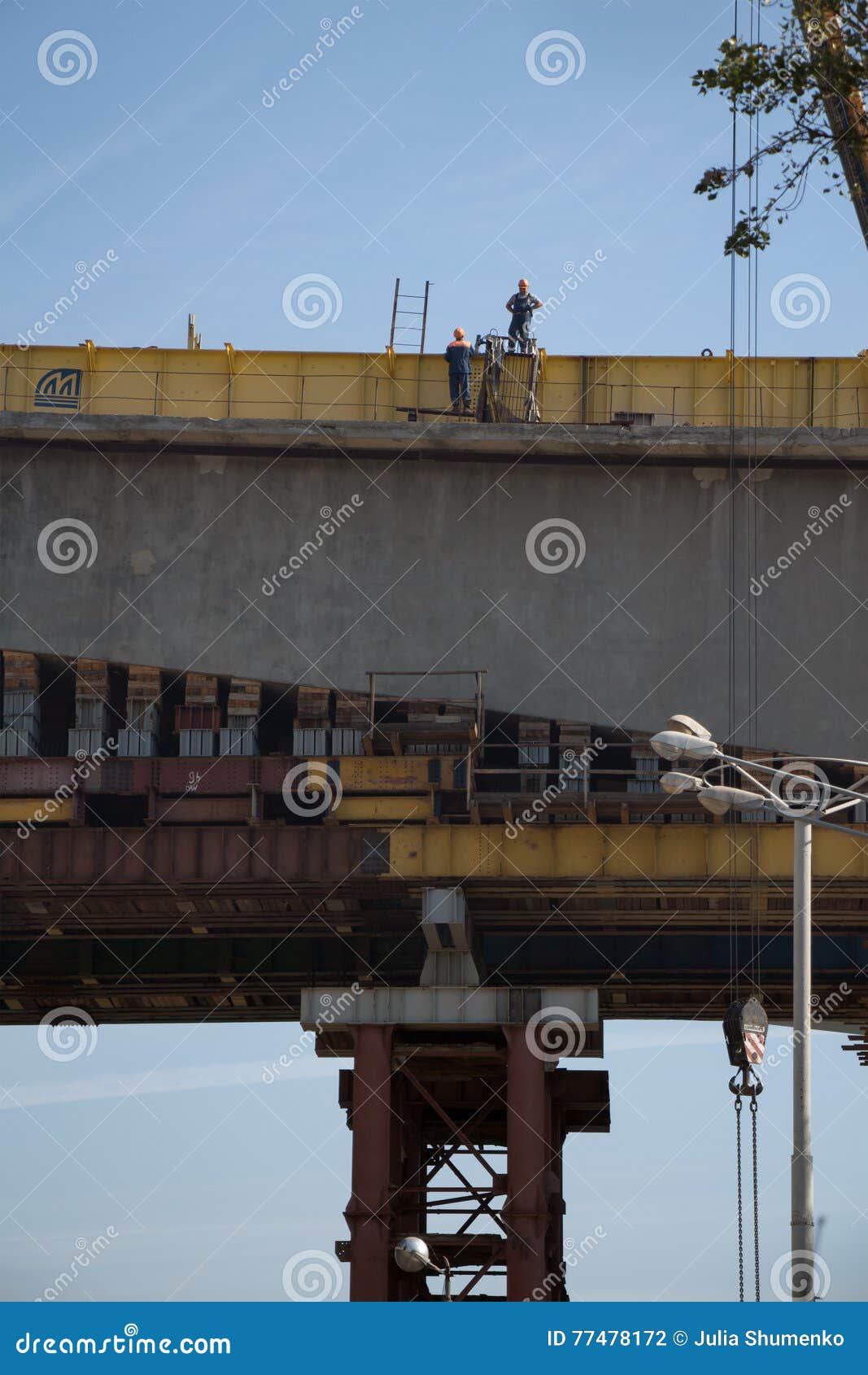 Two Workers in Workwear High on a Bridge Processing Construction ...