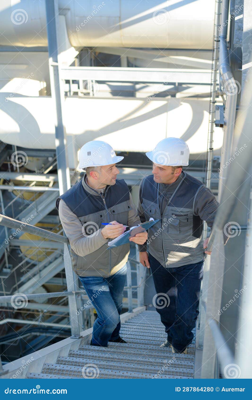 Two Workmen Ascending Outdoor Factory Staircase Stock Photo - Image of ...
