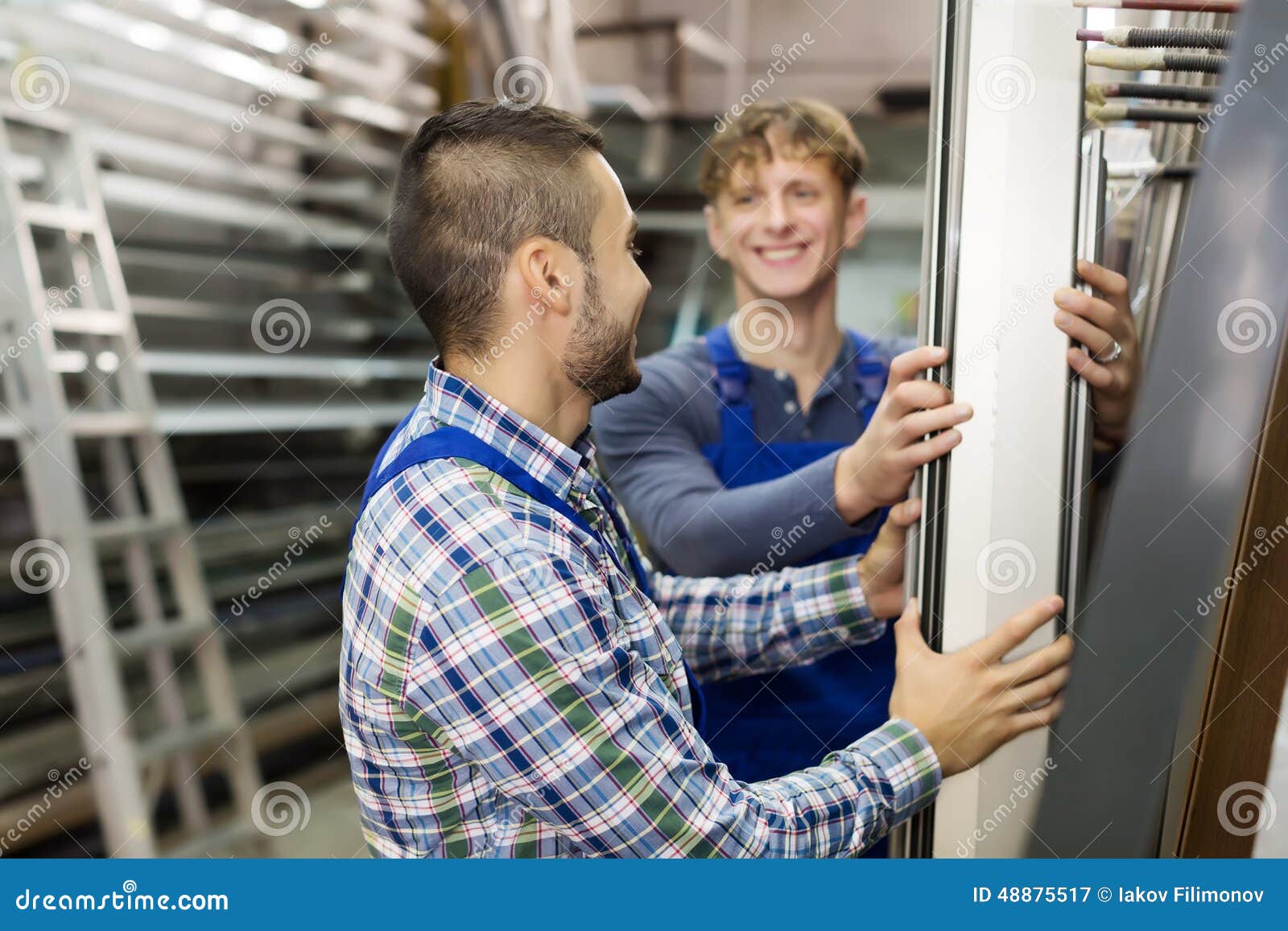 Two workmen choosing PVC stock image. Image of assembly - 48875517