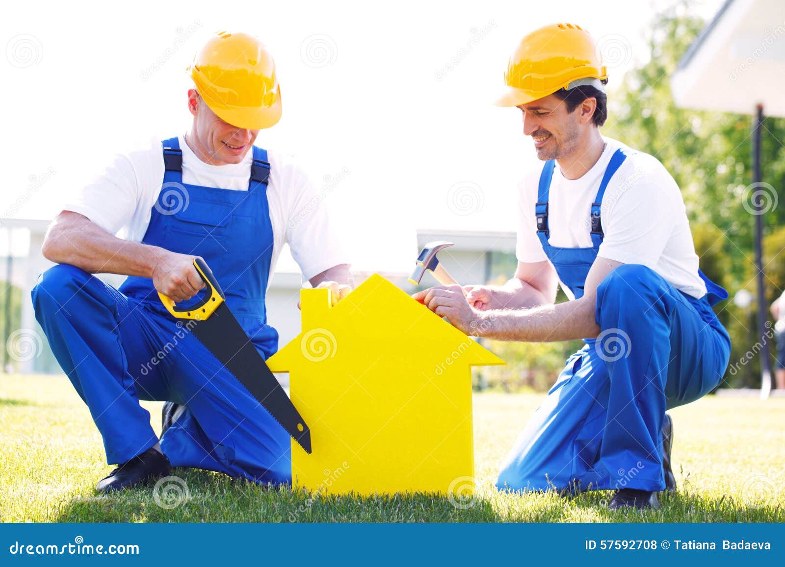 Two Workmen and House Symbol Stock Photo - Image of holding, outdoors ...