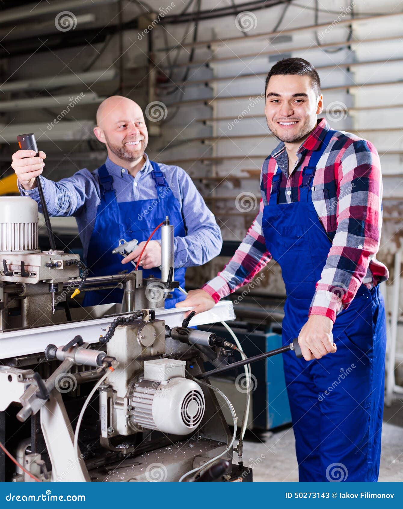Two workmen in PVC shop stock image. Image of brigade - 50273143