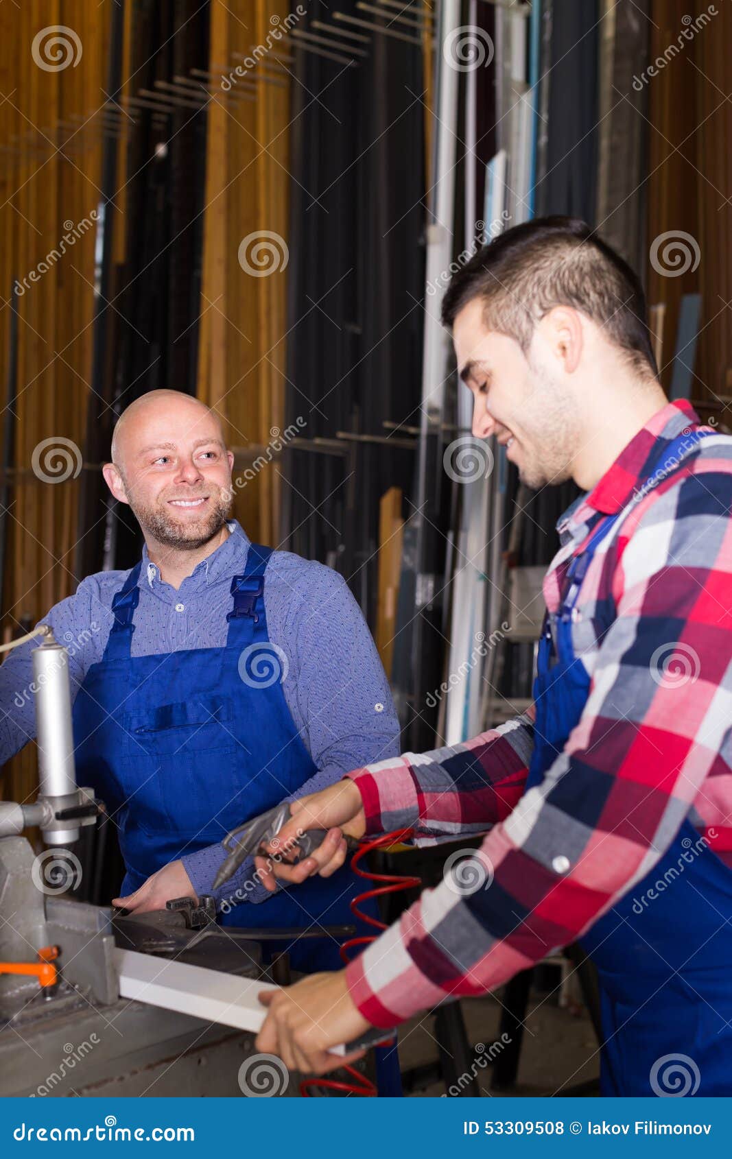 Two workmen in PVC shop stock photo. Image of profile - 53309508