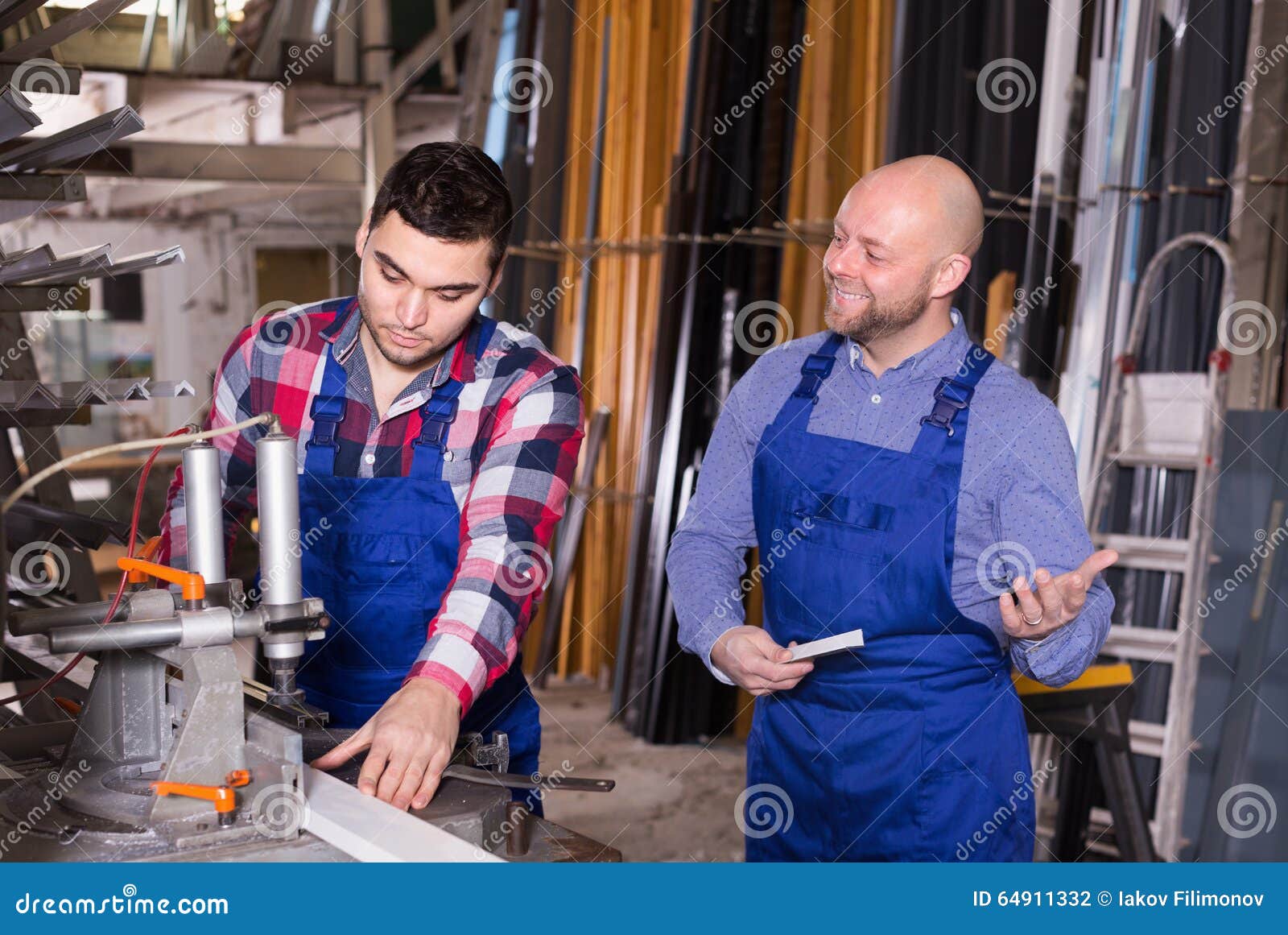 Two Workmen Working on Machine Stock Photo - Image of producing, indoor ...