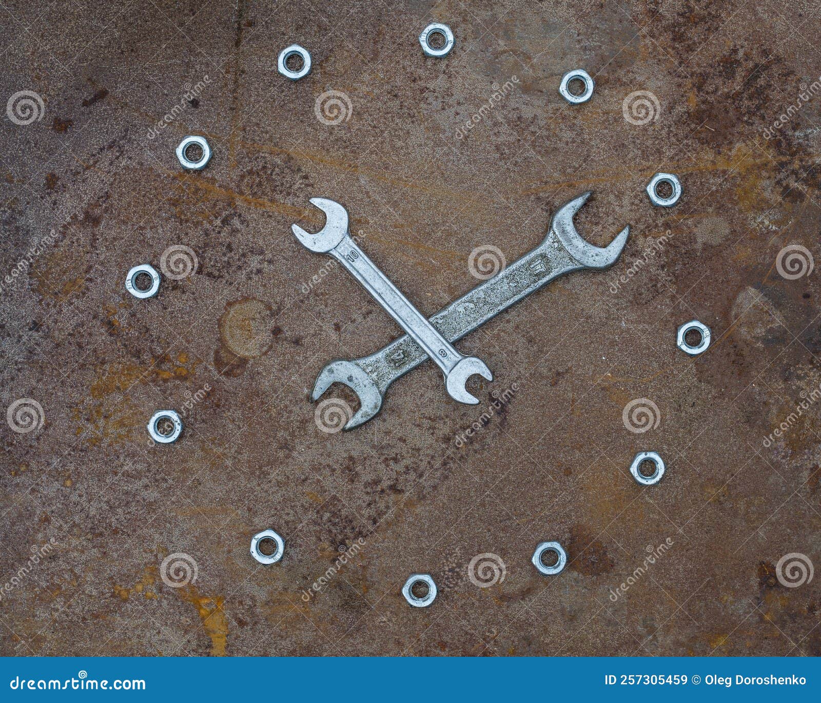 Two Wrenches and Nuts in the Shape of a Clock on an Old Rusty Metal ...