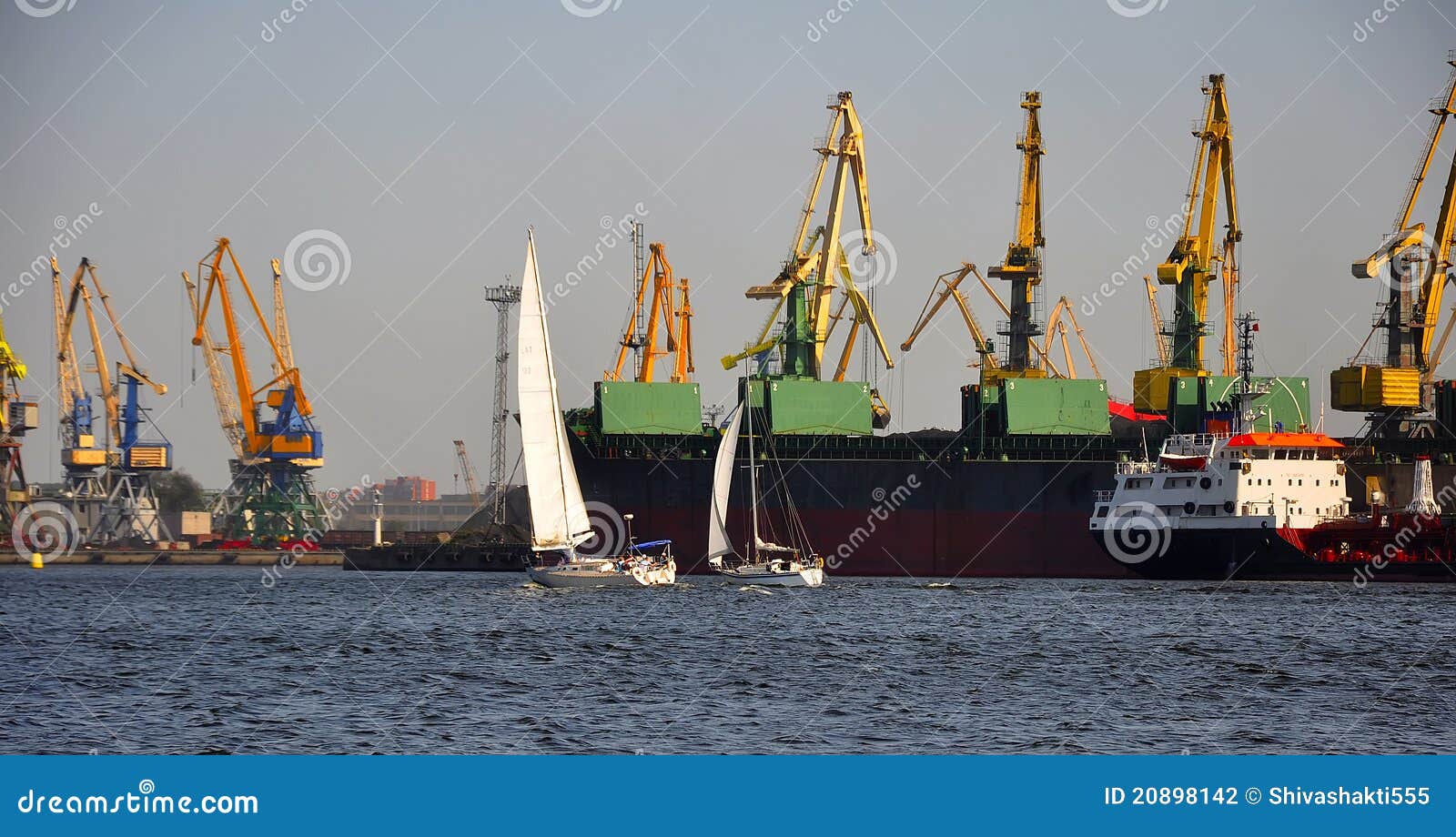 Two Yachts Against the Trading Ship Stock Photo - Image of commerce ...