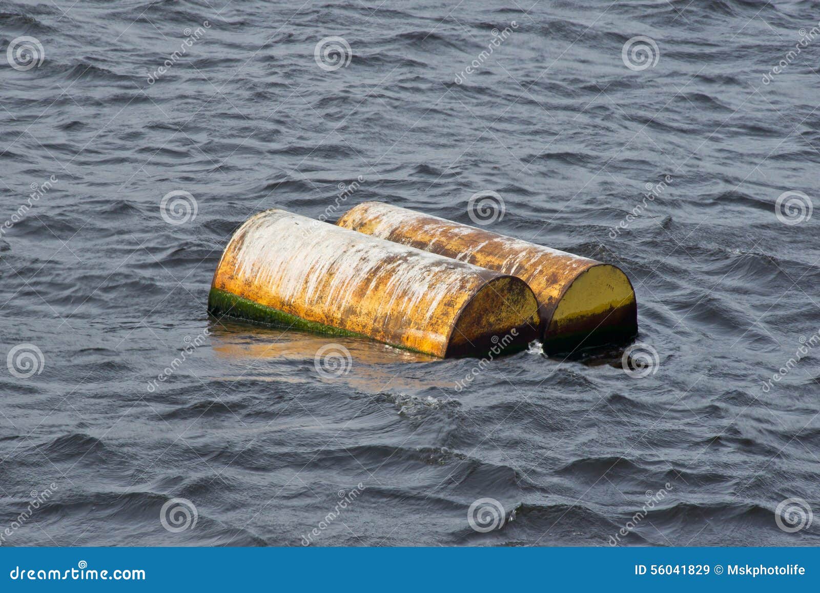 Two Yellow Barrels Drift on Water Stock Image - Image of industry, dust ...