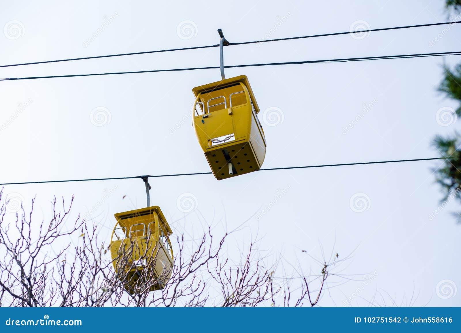 Two yellow cable car stock photo. Image of south, mountain - 102751542