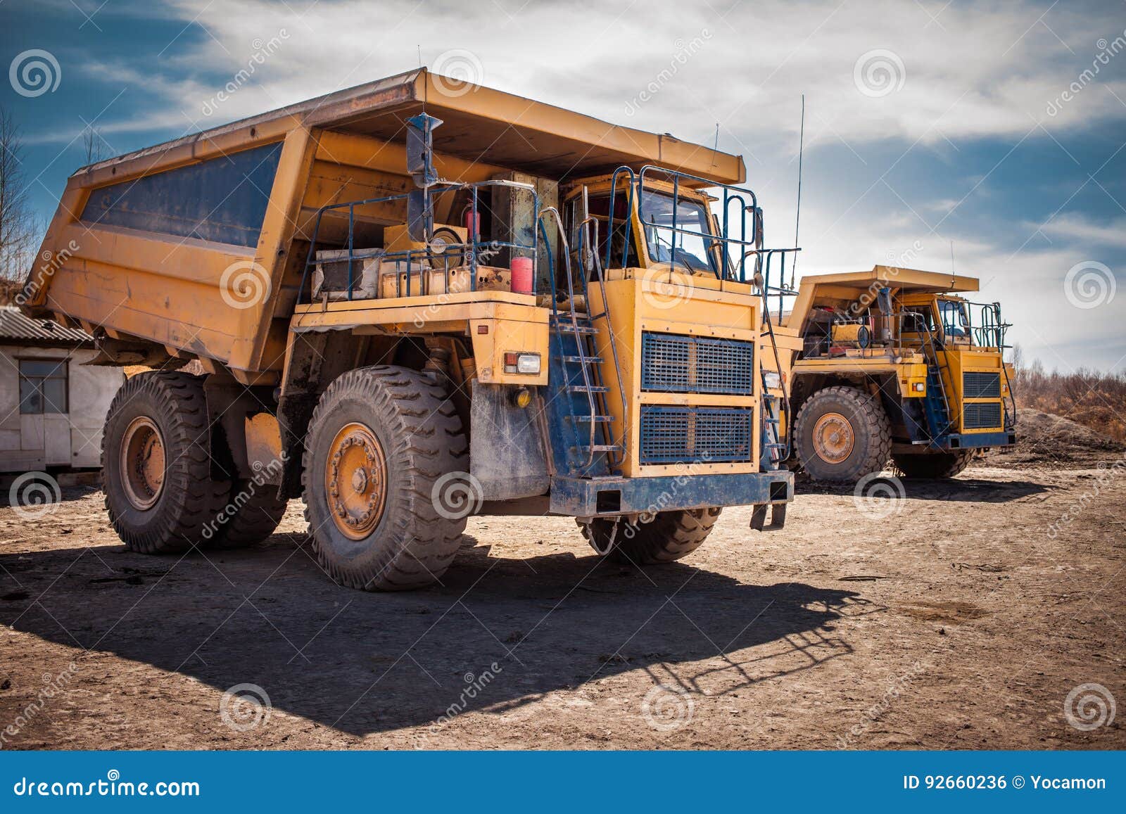 Two yellow dumpers stock photo. Image of carrier, carry - 92660236
