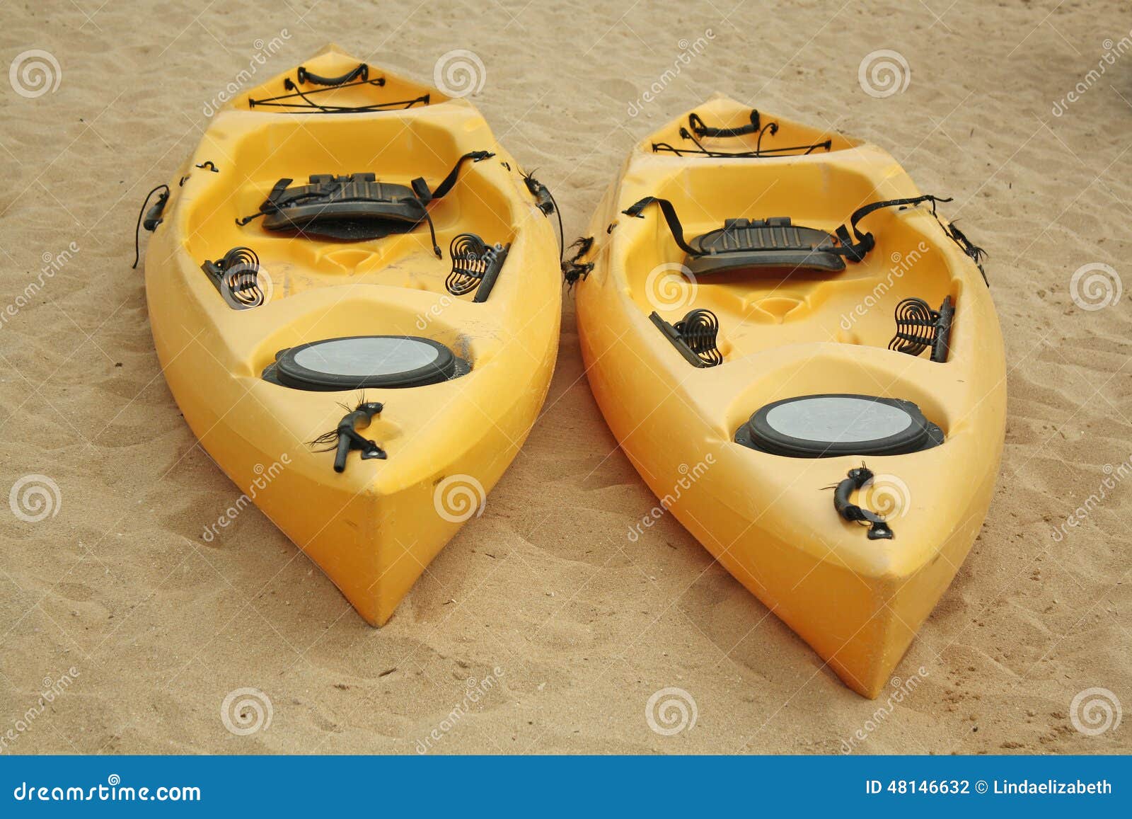 Two Yellow Kayaks Resting on Beach Stock Photo - Image of horizontal ...