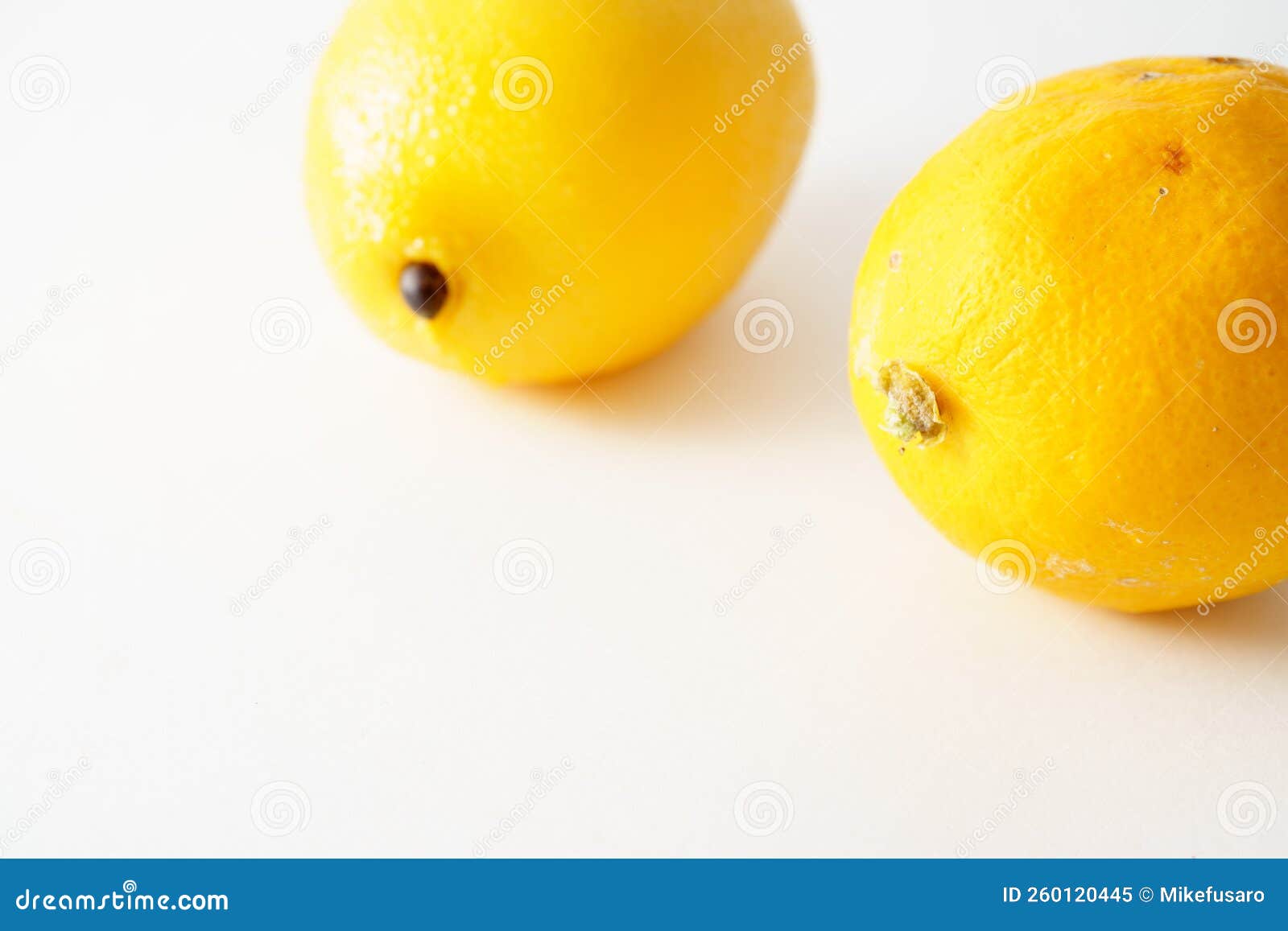 Two yellow lemons stock image. Image of yellow, healthy - 260120445