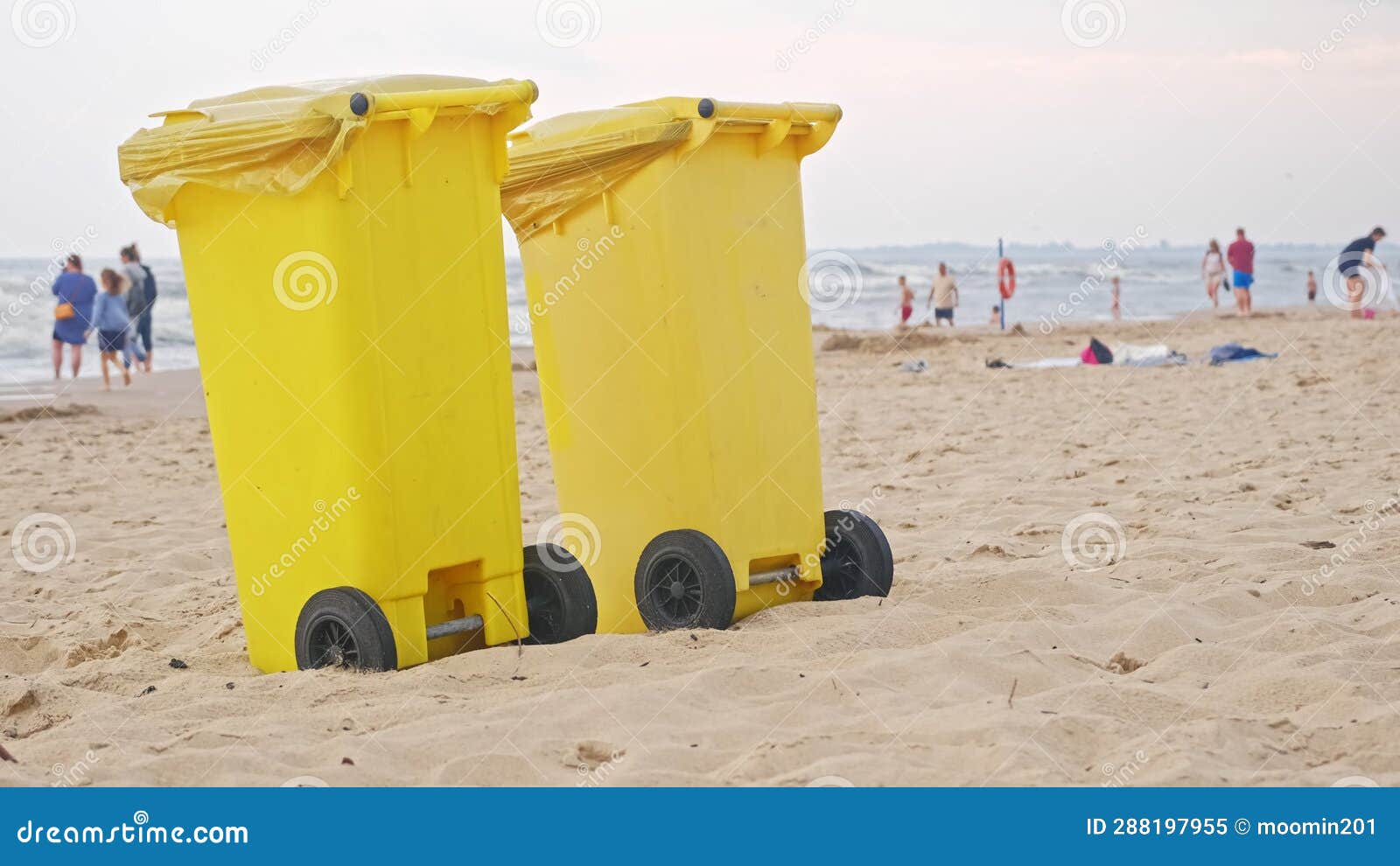 Two Yellow Plastic Garbage Bins Deployed on Seashore Beach Sand Stock ...