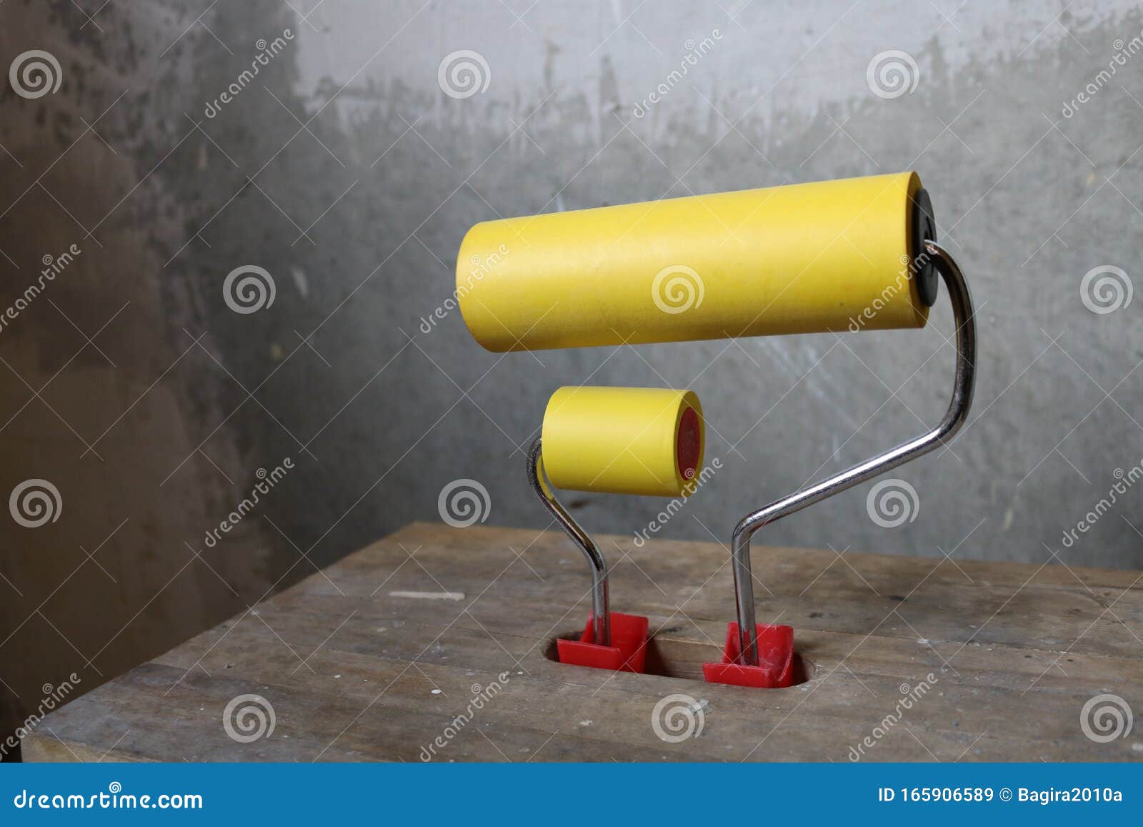Two Yellow Rubber Pressure Rollers with Red Handles Stock Image - Image ...