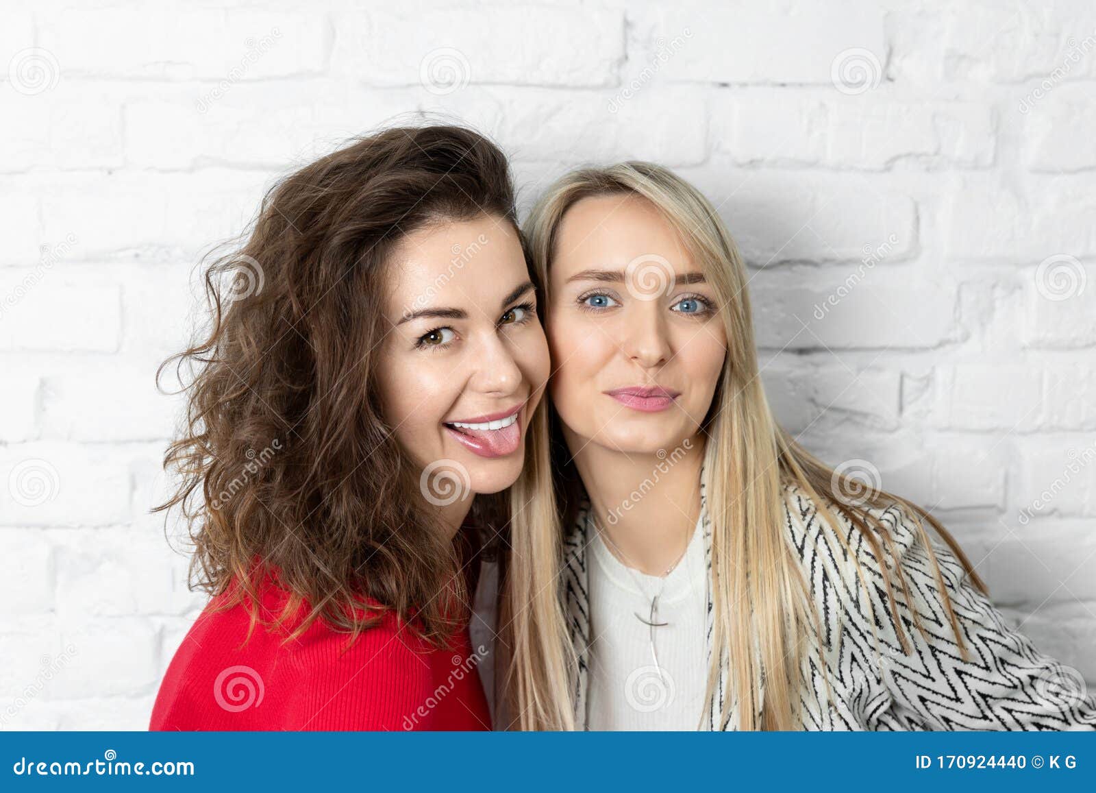 Two Young Adult Caucasian Girlfriends Having Fun And Enjoy Spending