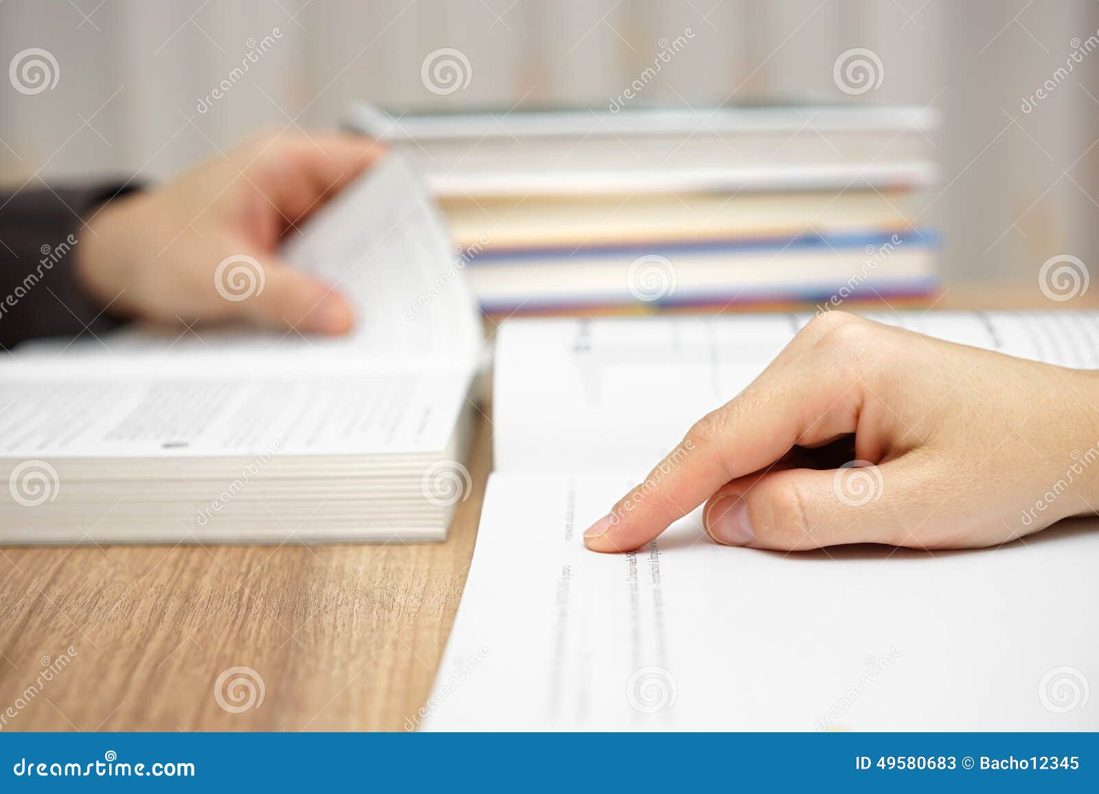 Two Young Adults are Studying and Reading Book Stock Image - Image of ...