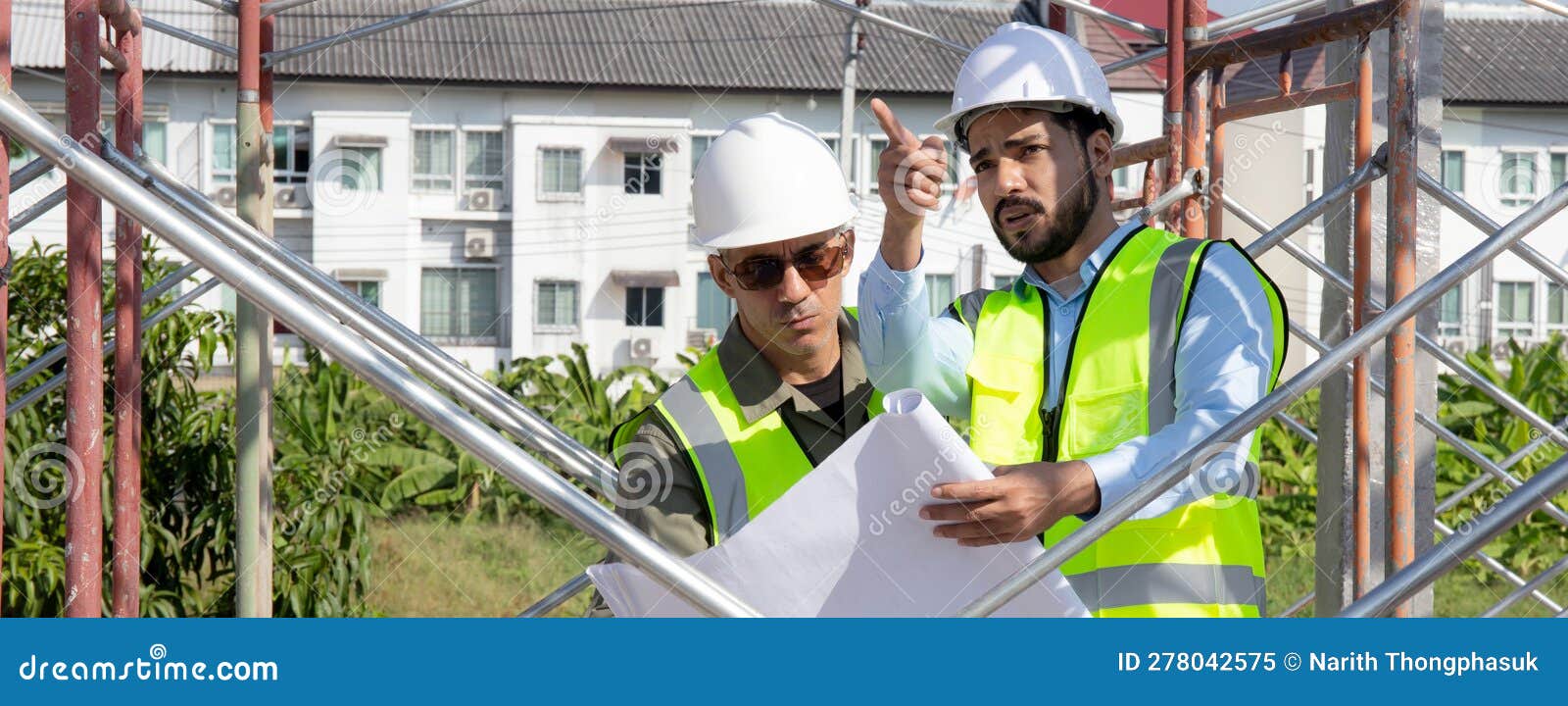 Two Young Architect Discussion or Contractor Man while Looking ...