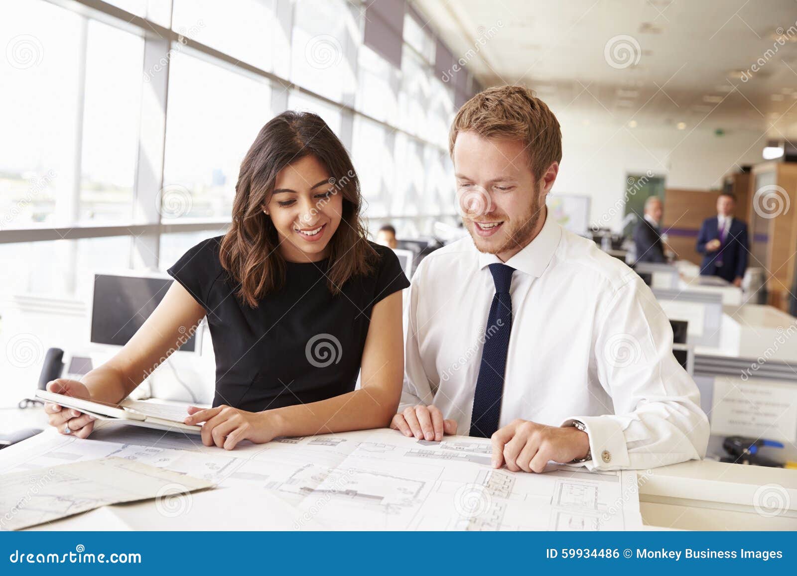Two Young Architects Working Together in an Office Stock Photo - Image ...