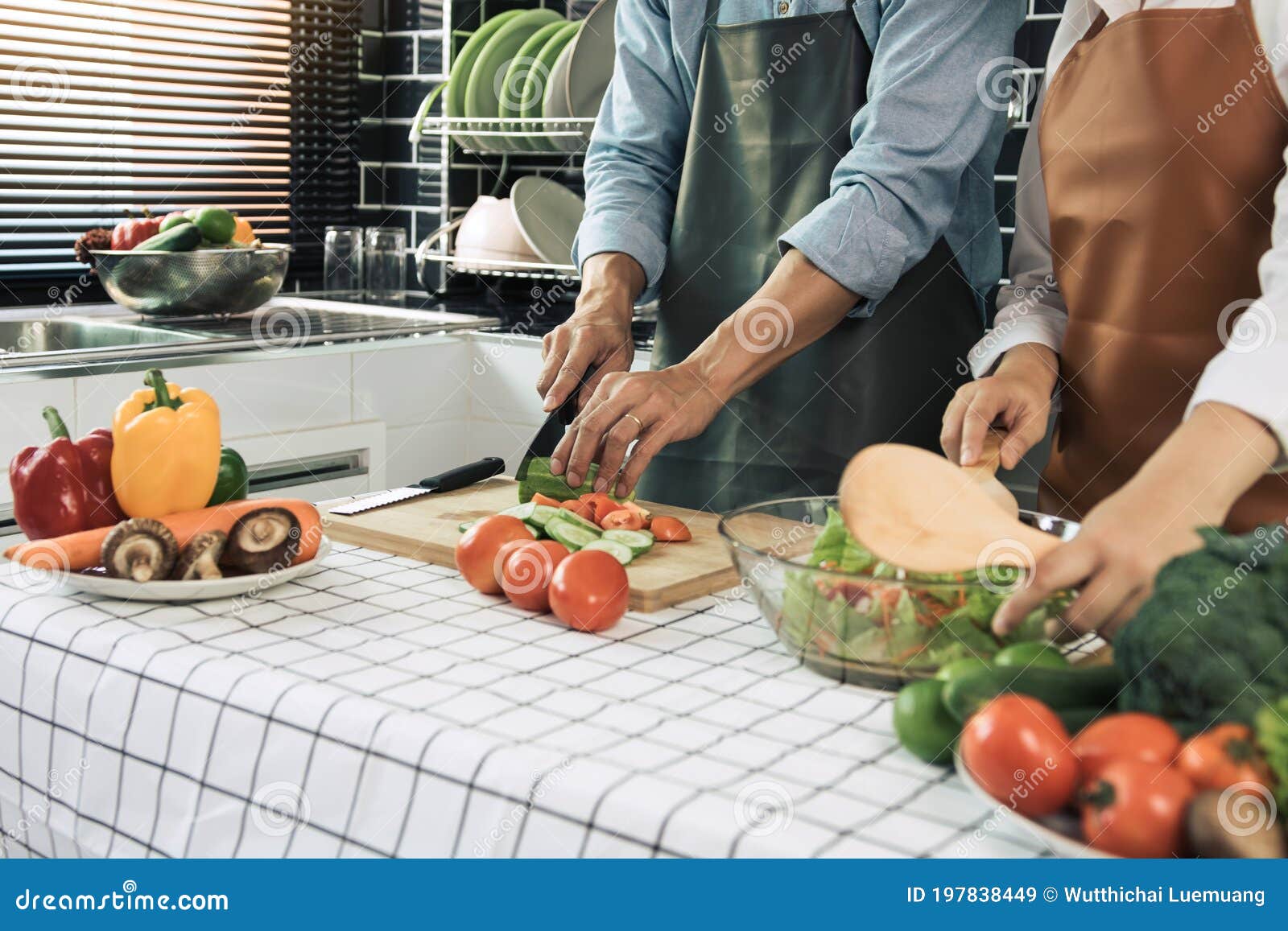 Two Young Asian Couples are Helping Each Other and Enjoying Cooking in ...