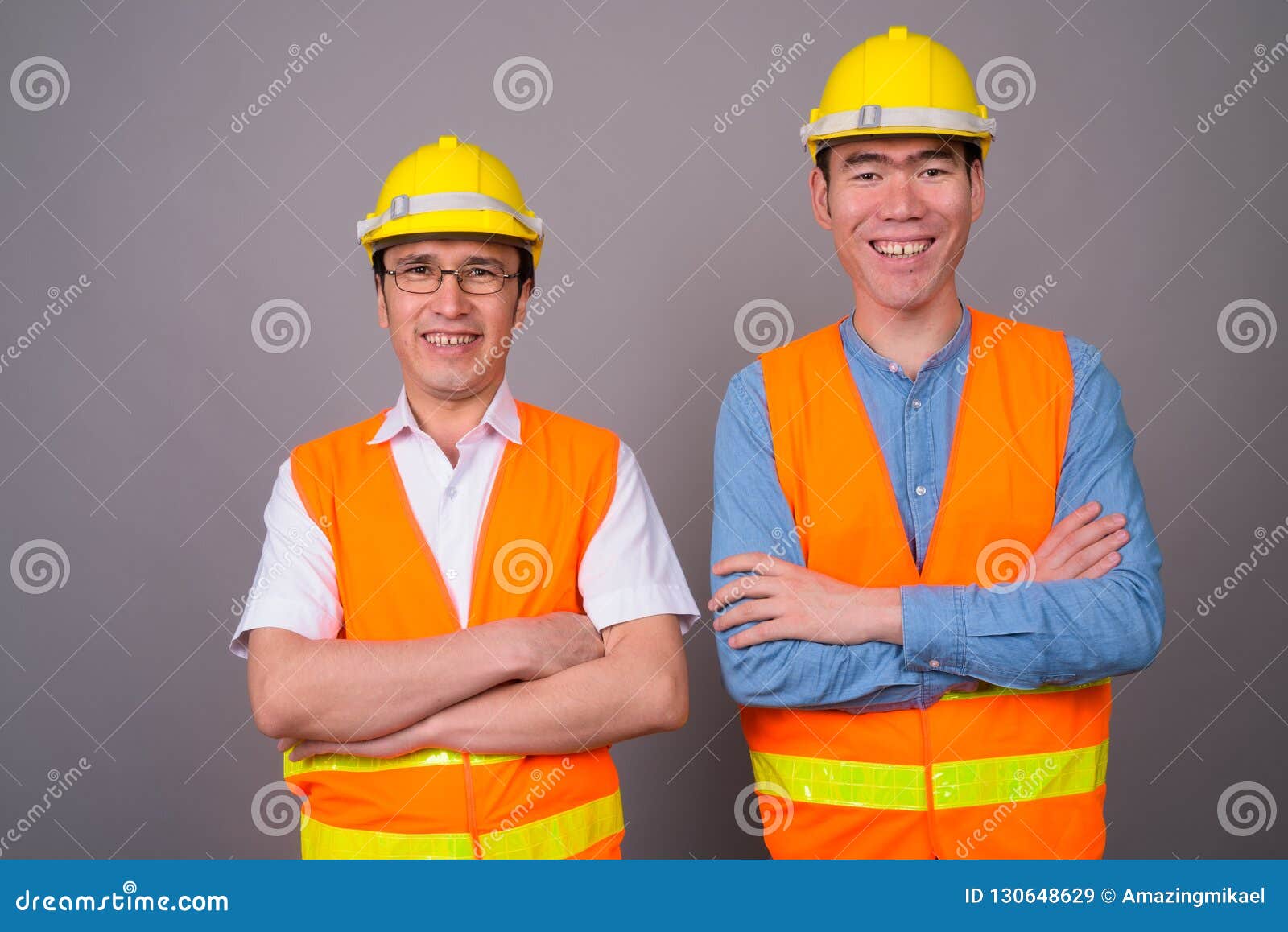 Two Young Asian Men Construction Worker Together Against Gray Ba Stock ...