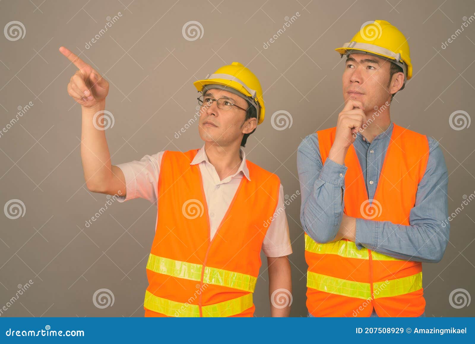Two Young Asian Men Construction Worker Together Against Gray ...