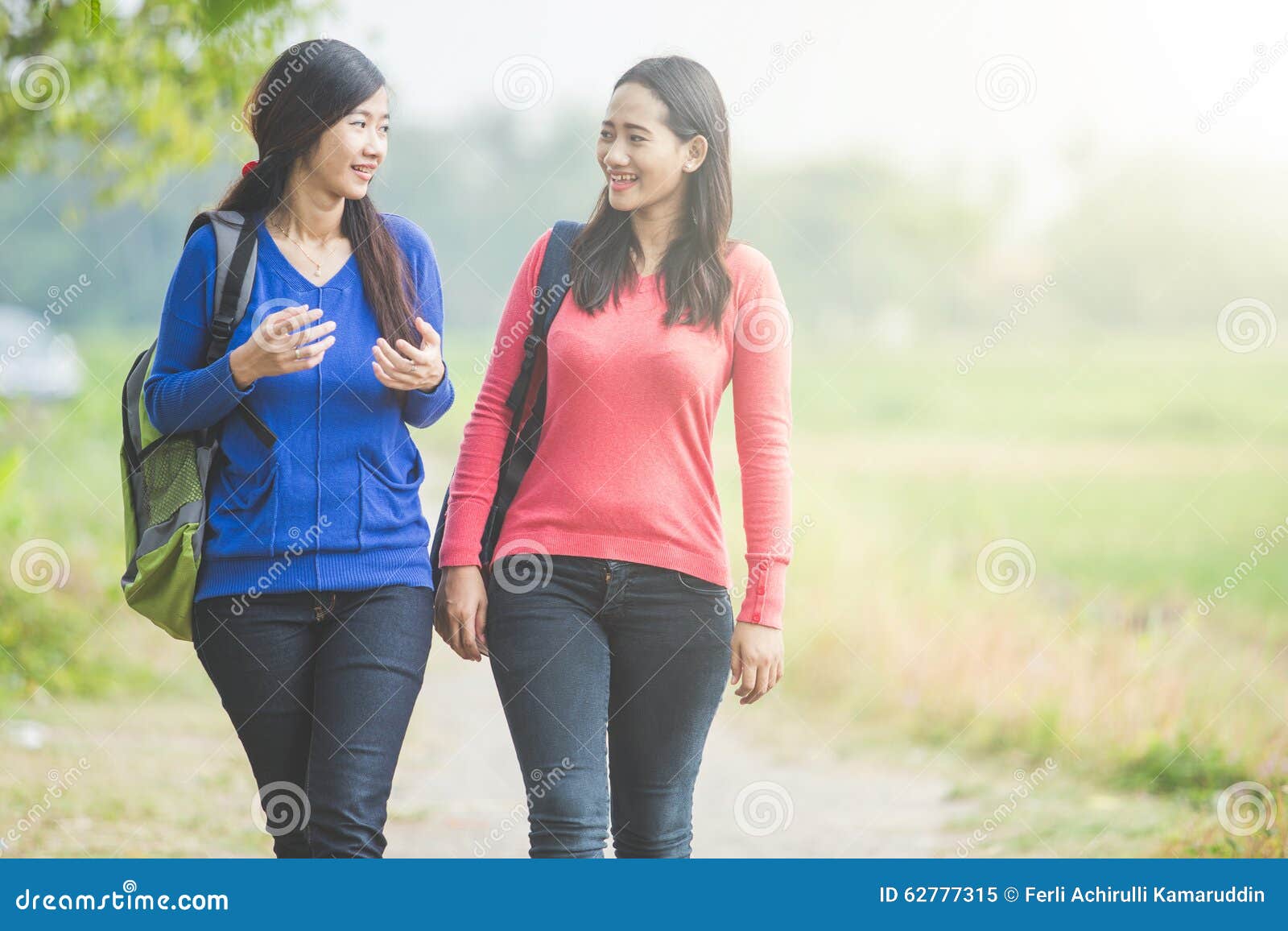 Two Young Asian Students Chatting while Walking Together Stock Image ...