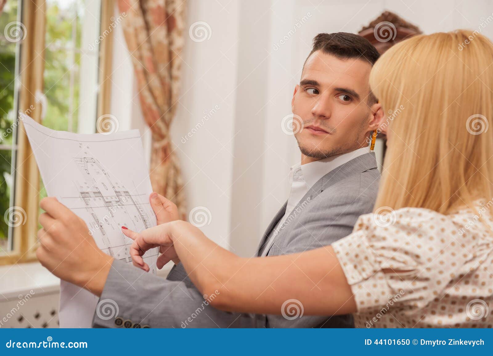 Two Young Attractive Architects Discussing Design Stock Photo - Image ...