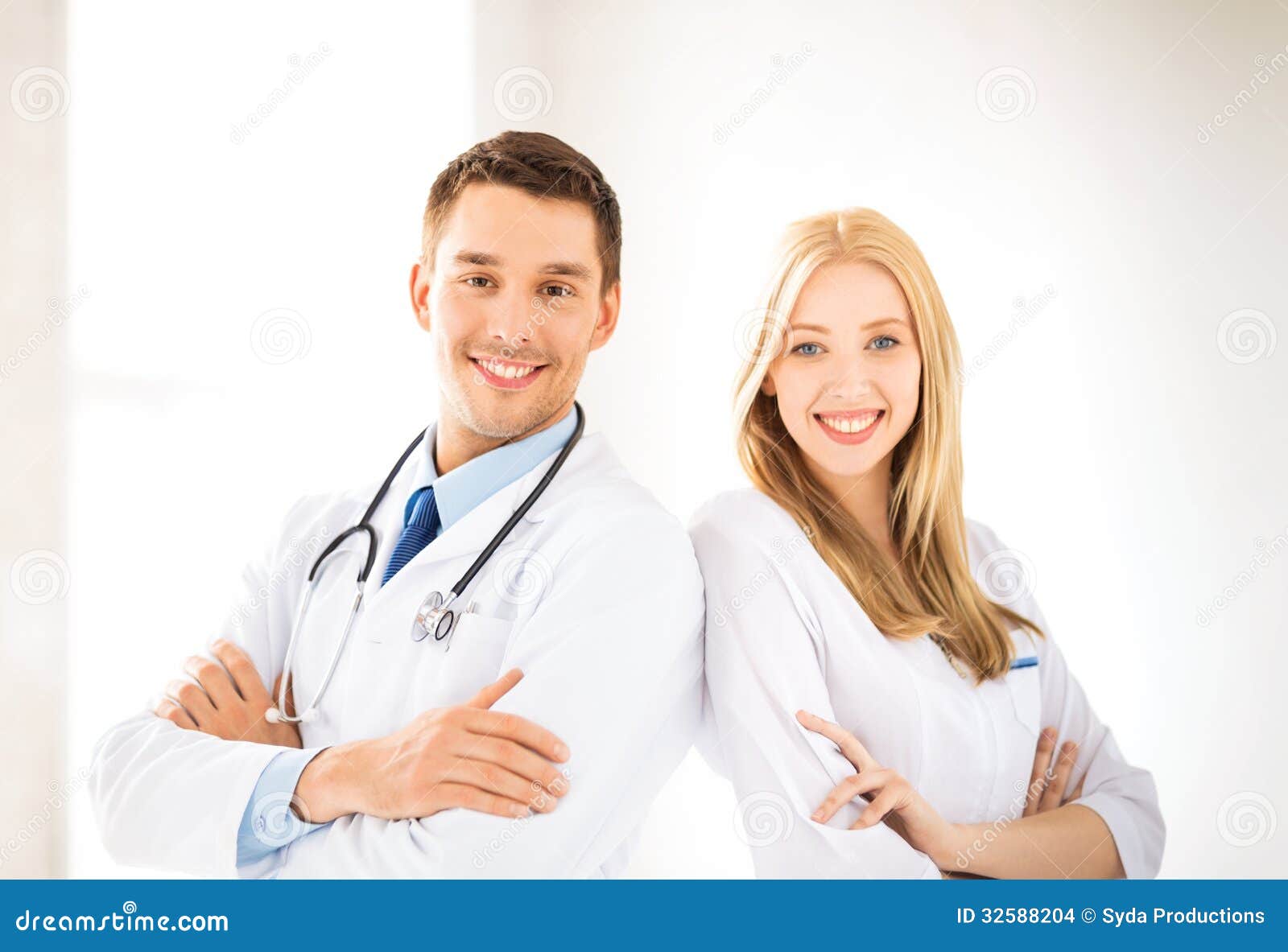 Two Young Attractive Doctors Stock Photo - Image of clinical ...