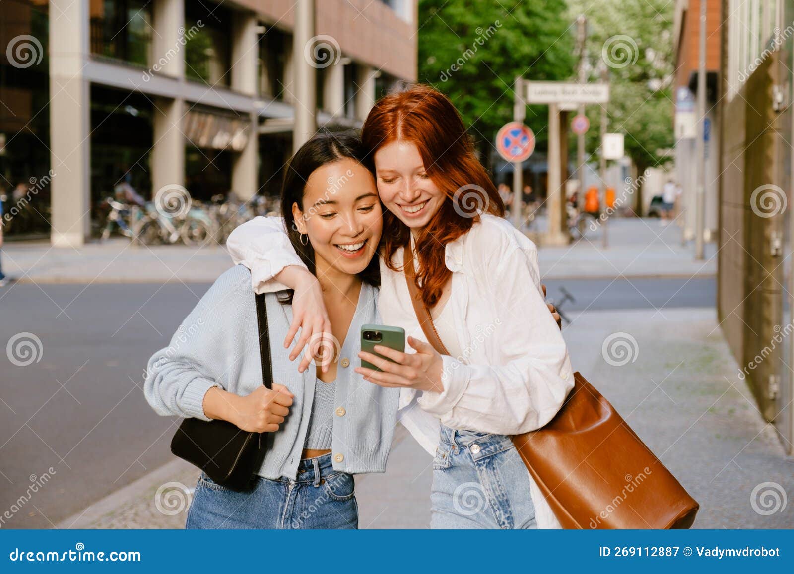 Two Young Beautiful Smiling Happy Girls Hugging Each Other Stock Image