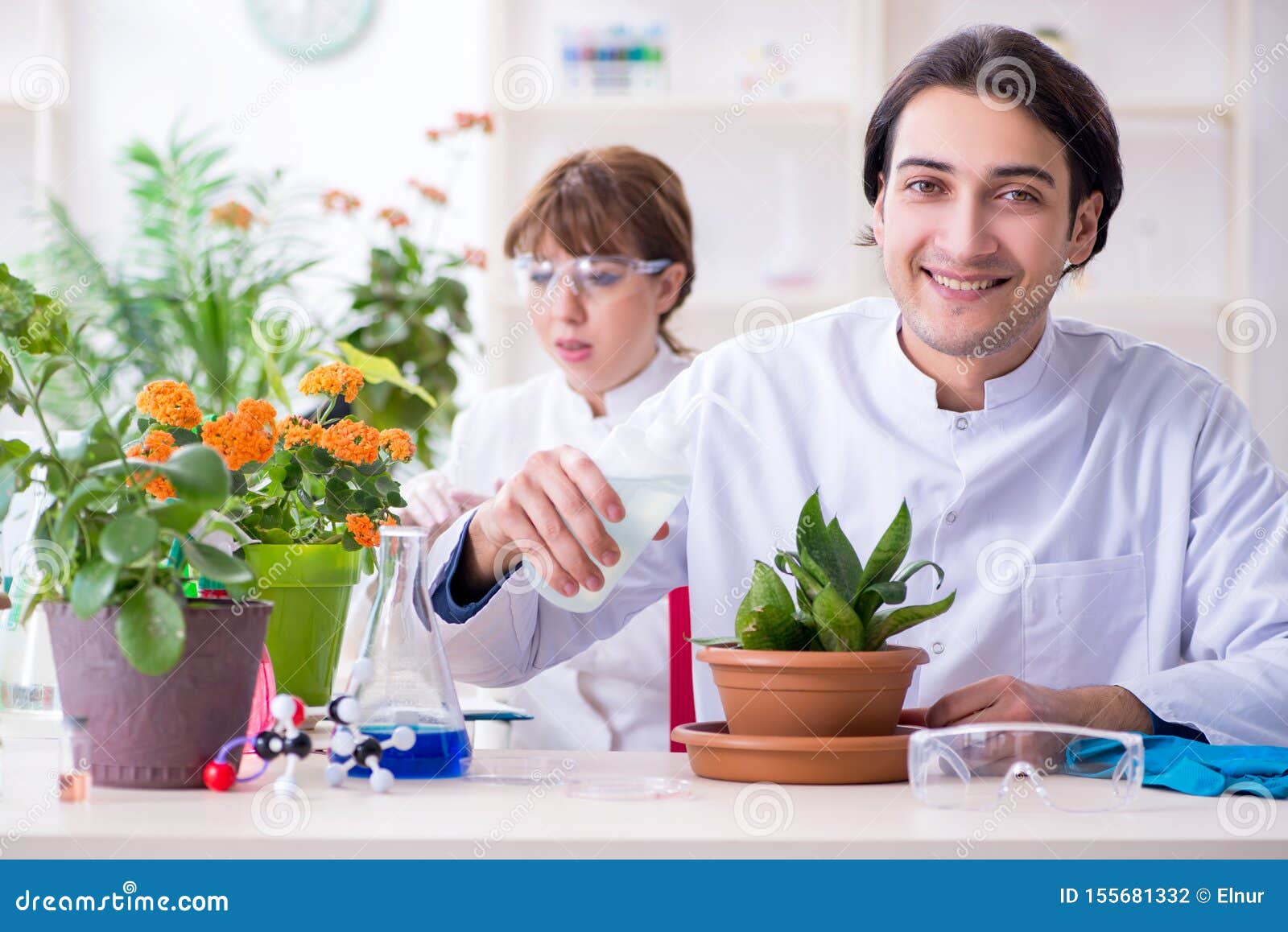 Two Young Botanist Working in the Lab Stock Photo - Image of ...