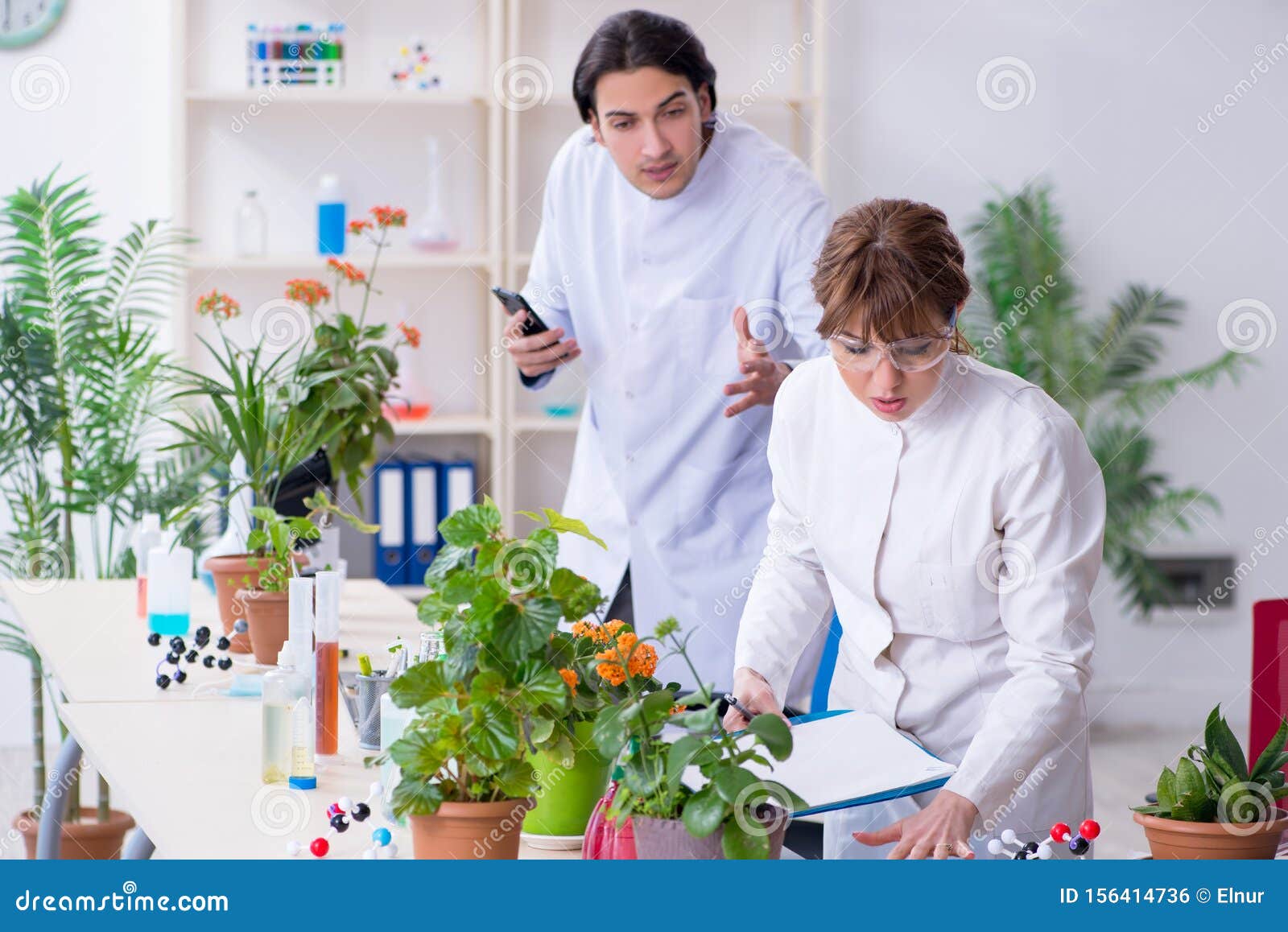 Two Young Botanist Working in the Lab Stock Photo - Image of plants ...