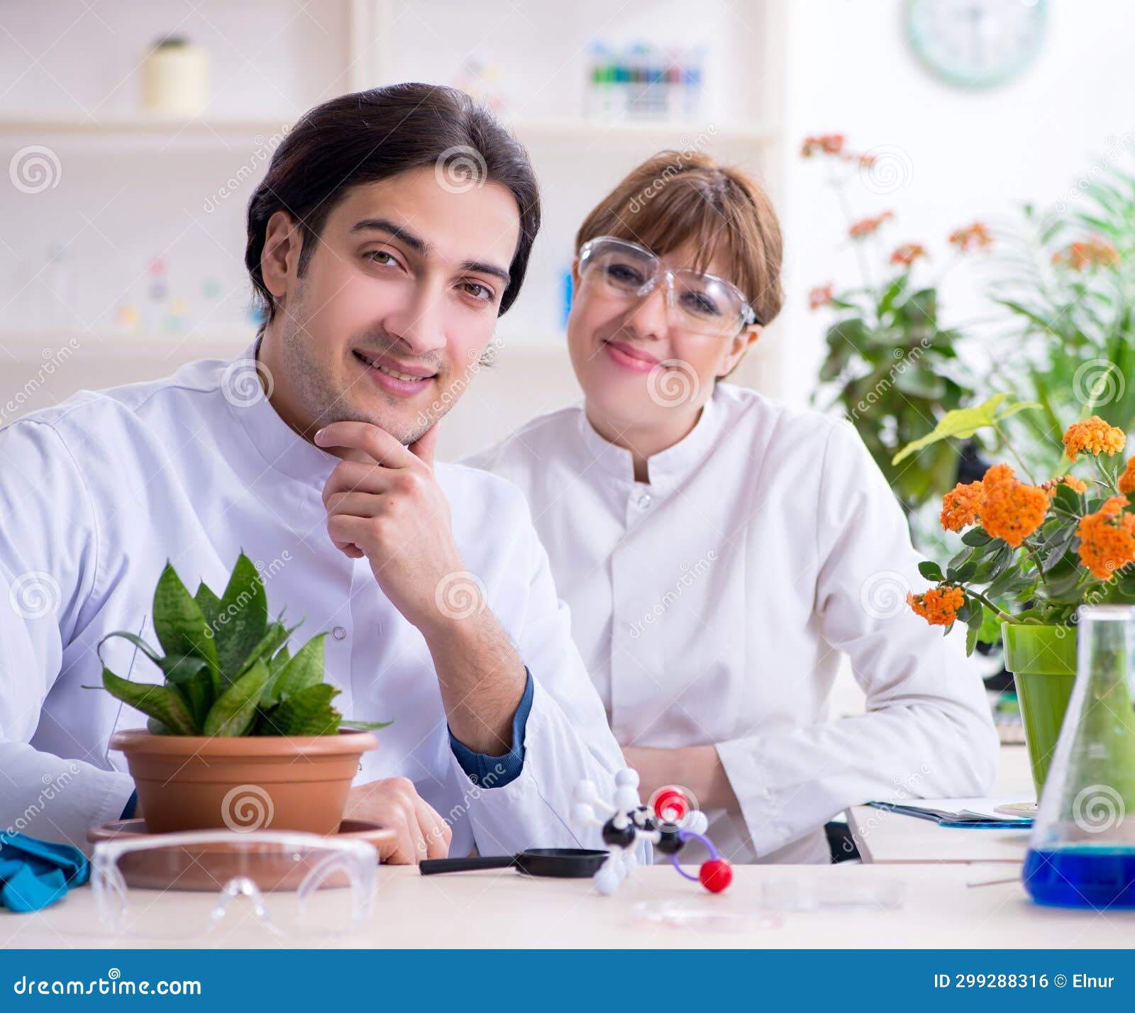 Two Young Botanist Working in the Lab Stock Photo - Image of cheerful ...
