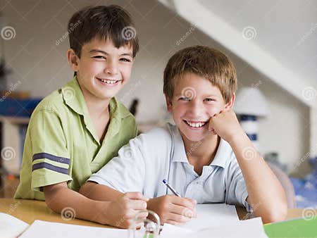 Two Young Boys Doing Their Homework Together Stock Image - Image of ...