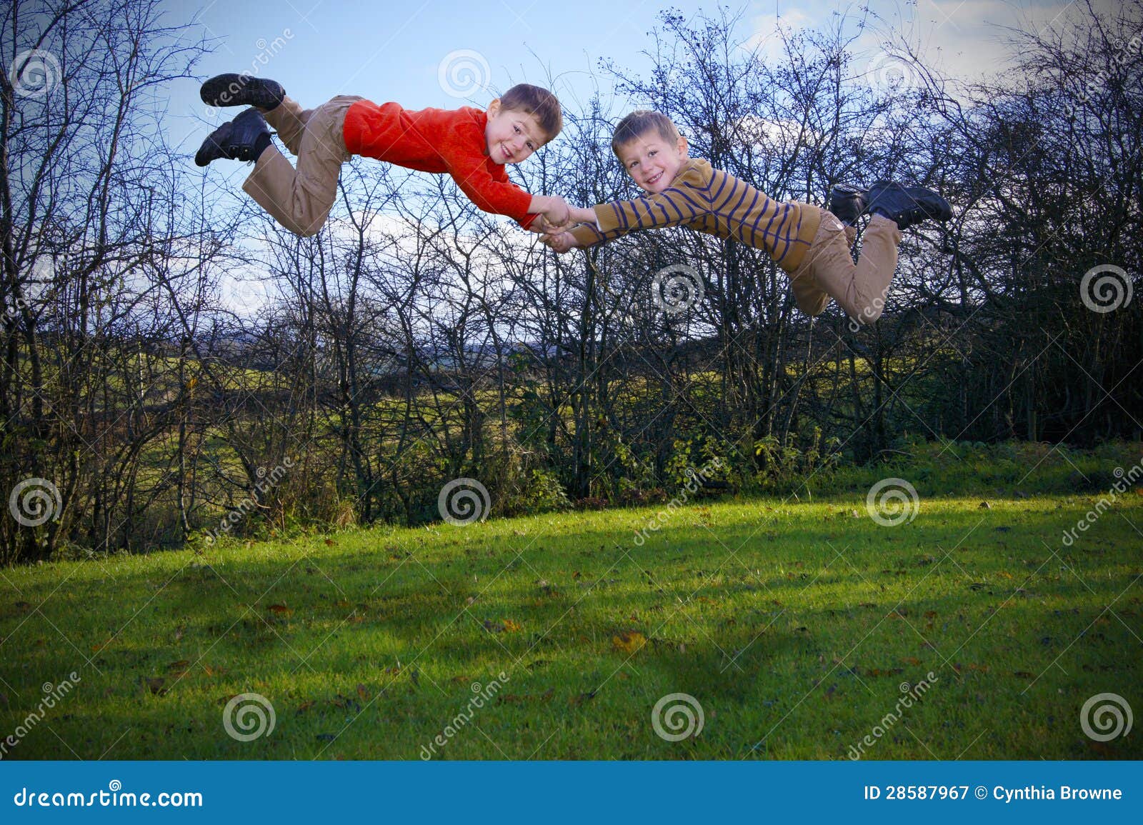 Two Young Boys Flying Outdoors Stock Image - Image of surrealism ...