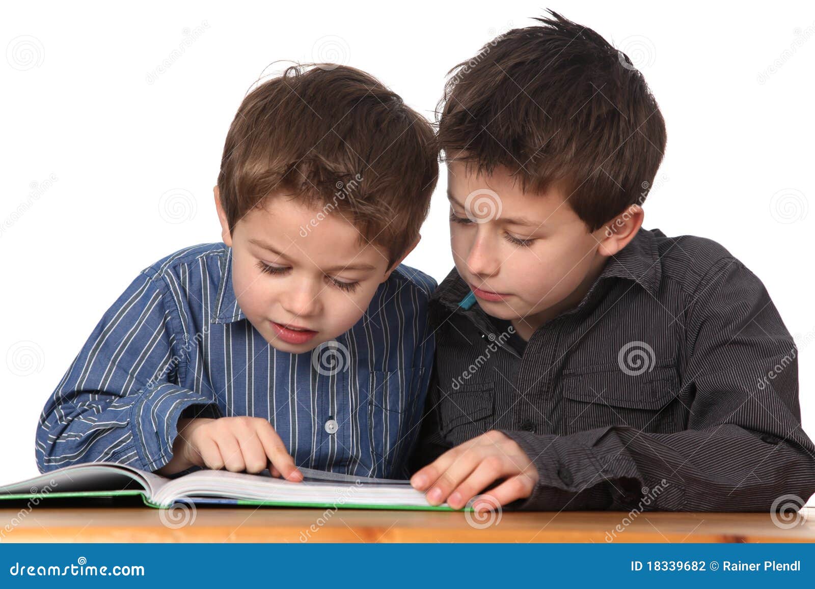 Two young boys learning stock photo. Image of small, male - 18339682