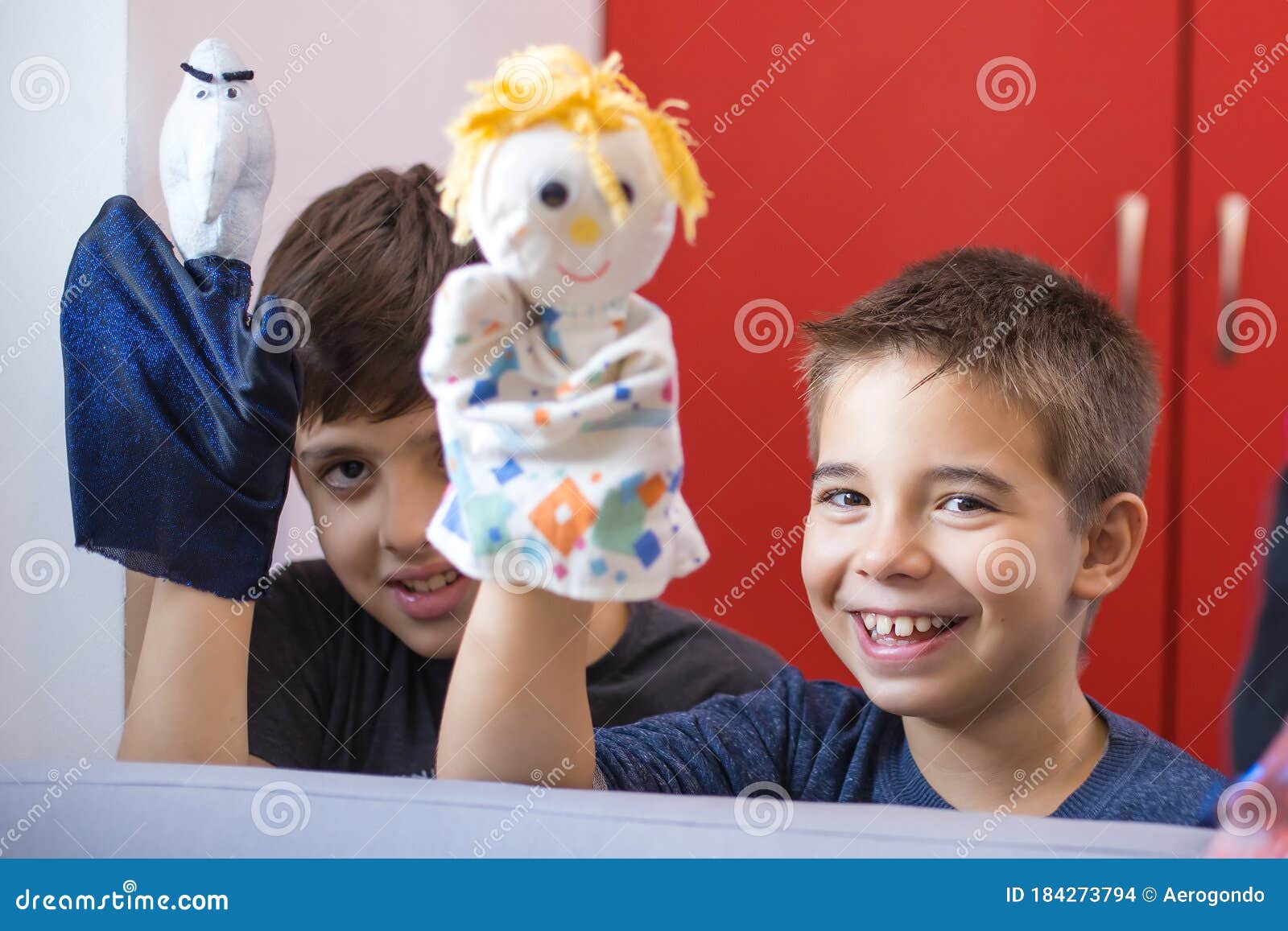 Two Young Boys Playing with Puppets Stock Photo - Image of motion ...