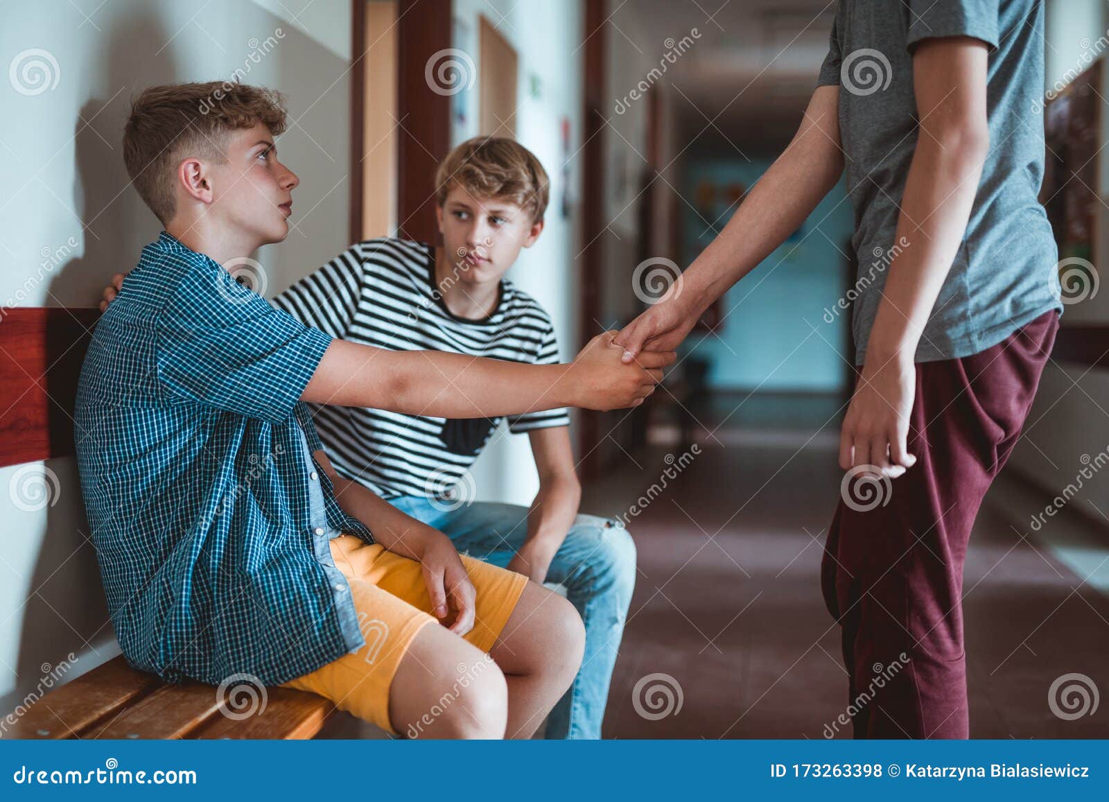 Young Boys Say Hello To Each Other at the School Corridor Stock Photo ...