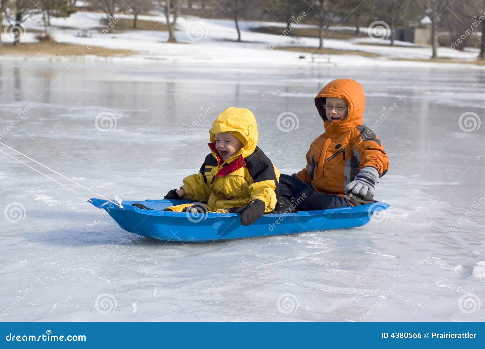 Two Young Boys Sled on Icy Lake Stock Photo - Image of cute, child: 4380566