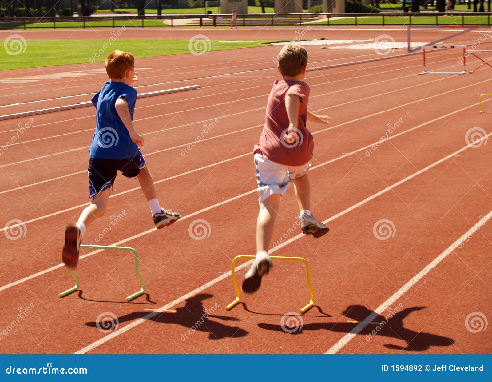 Two Young Boys with Small Hurdles Stock Photo - Image of sunshine ...