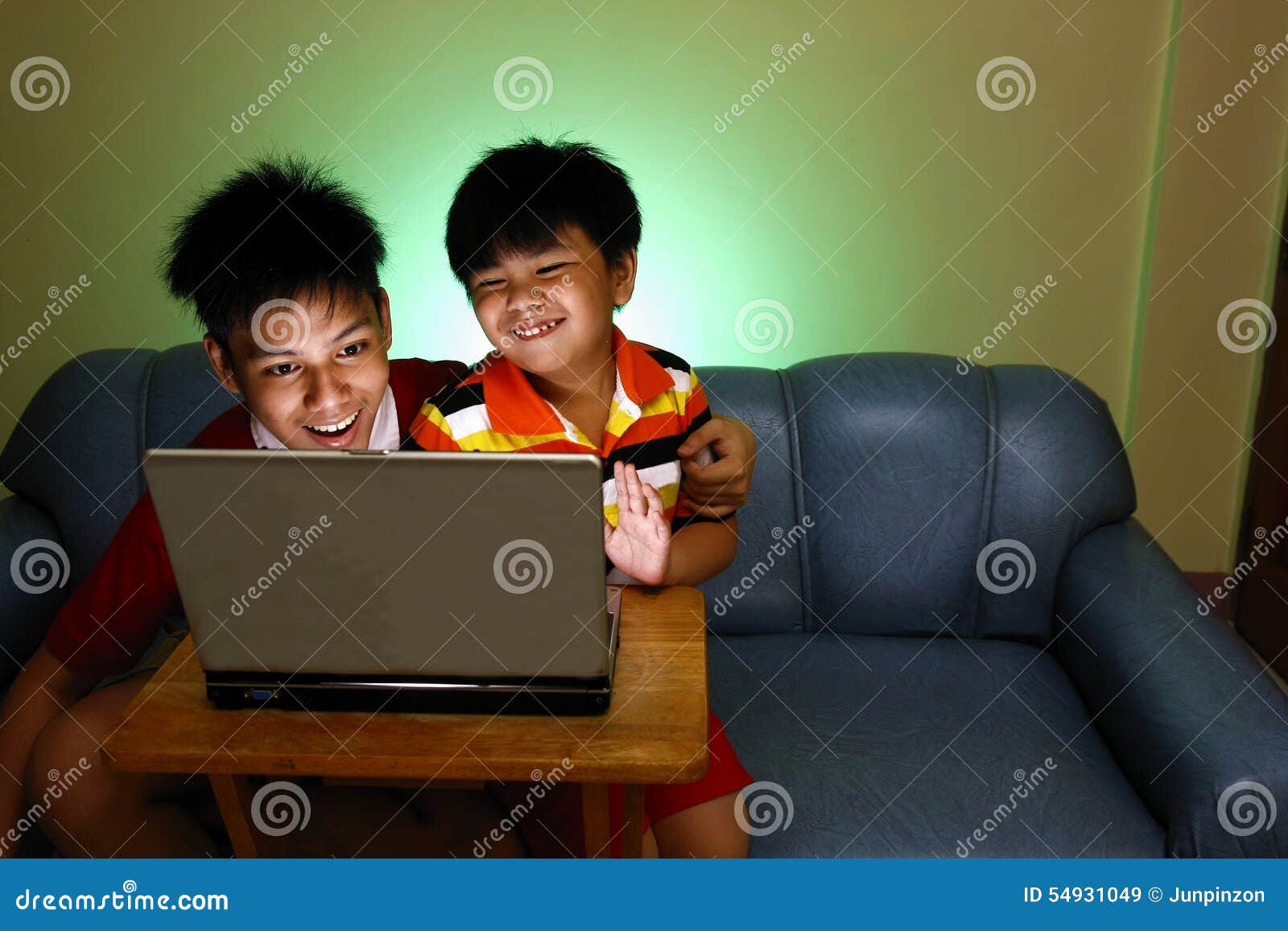 Two Young Boys Using a Laptop Computer and Smiling Stock Image - Image ...