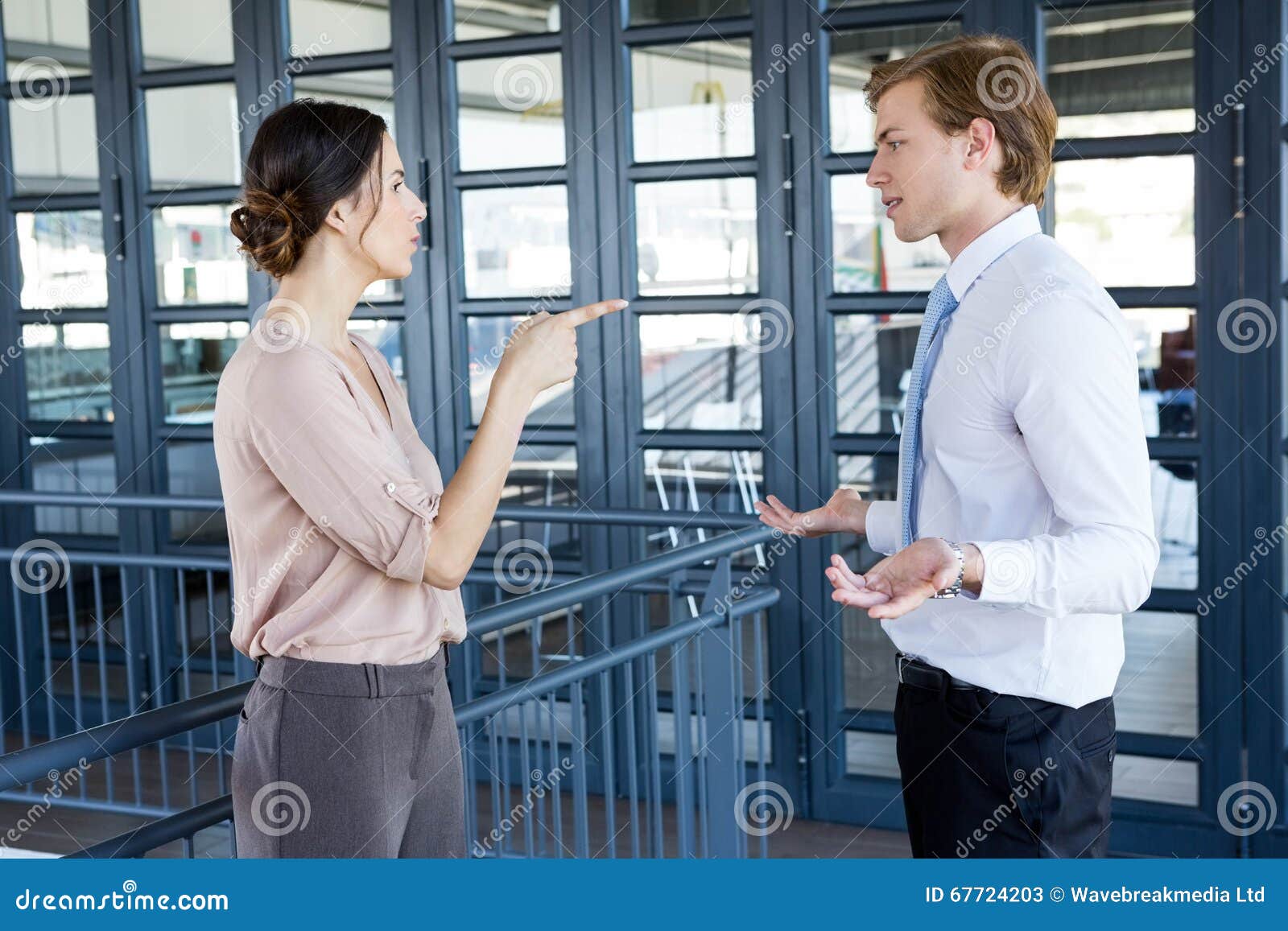 Two Young Business Colleagues Having an Argument Stock Image - Image of ... Two Young Business Colleagues Having an Argument Stock Image - Image of ...