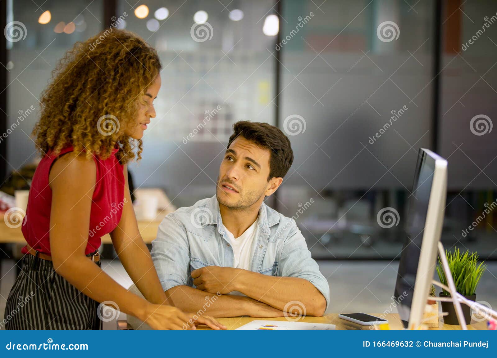 Two Young Business Colleagues Working on Computer, Working Together on ... Two Young Business Colleagues Working on Computer, Working Together on ...
