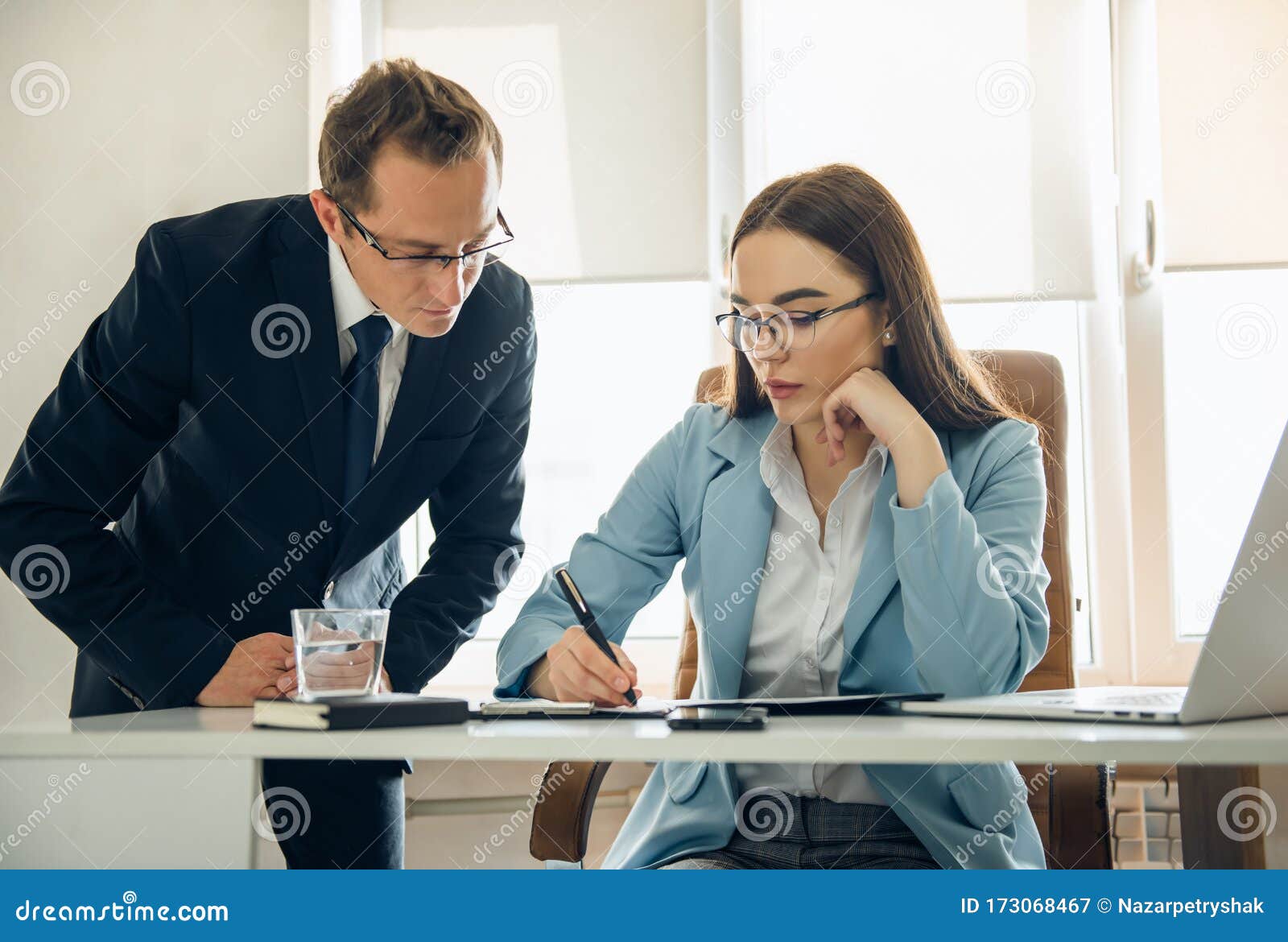 Two Young Business Colleagues Working on Computer Stock Image - Image ... Two Young Business Colleagues Working on Computer Stock Image - Image ...