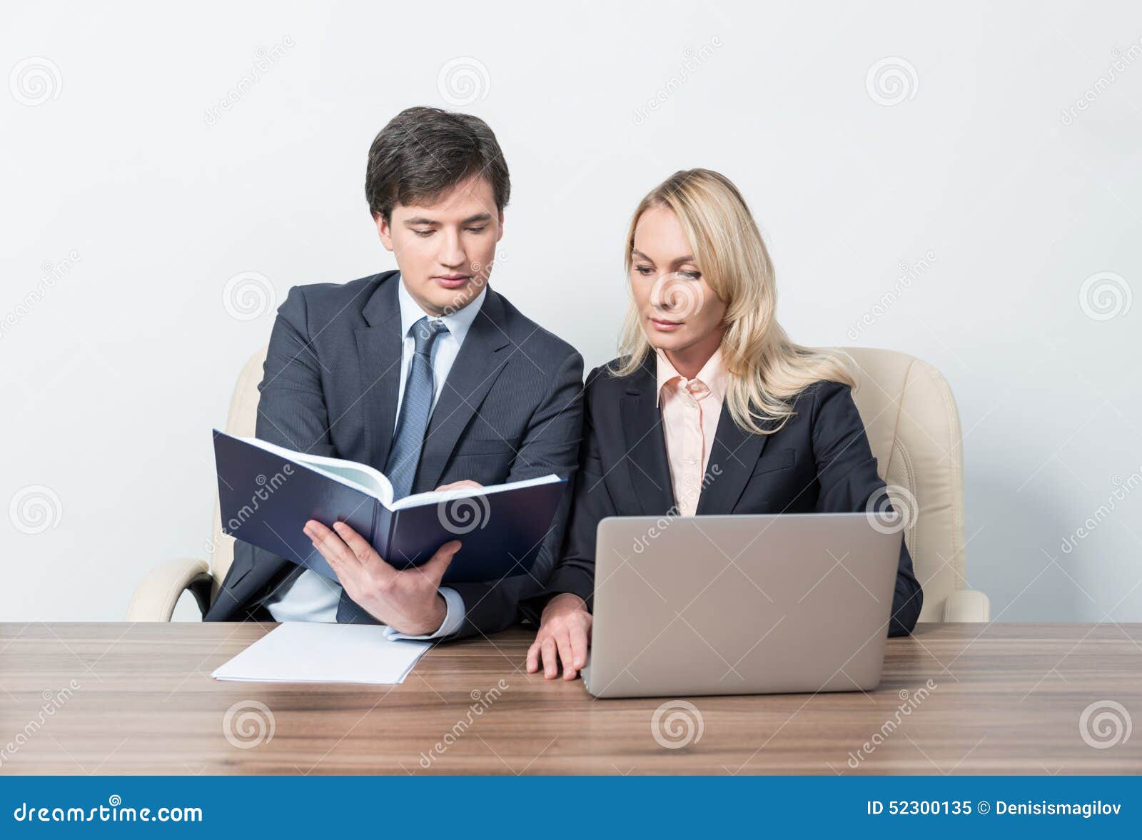 Two Young Business Partners at Meeting Stock Image - Image of sitting ...