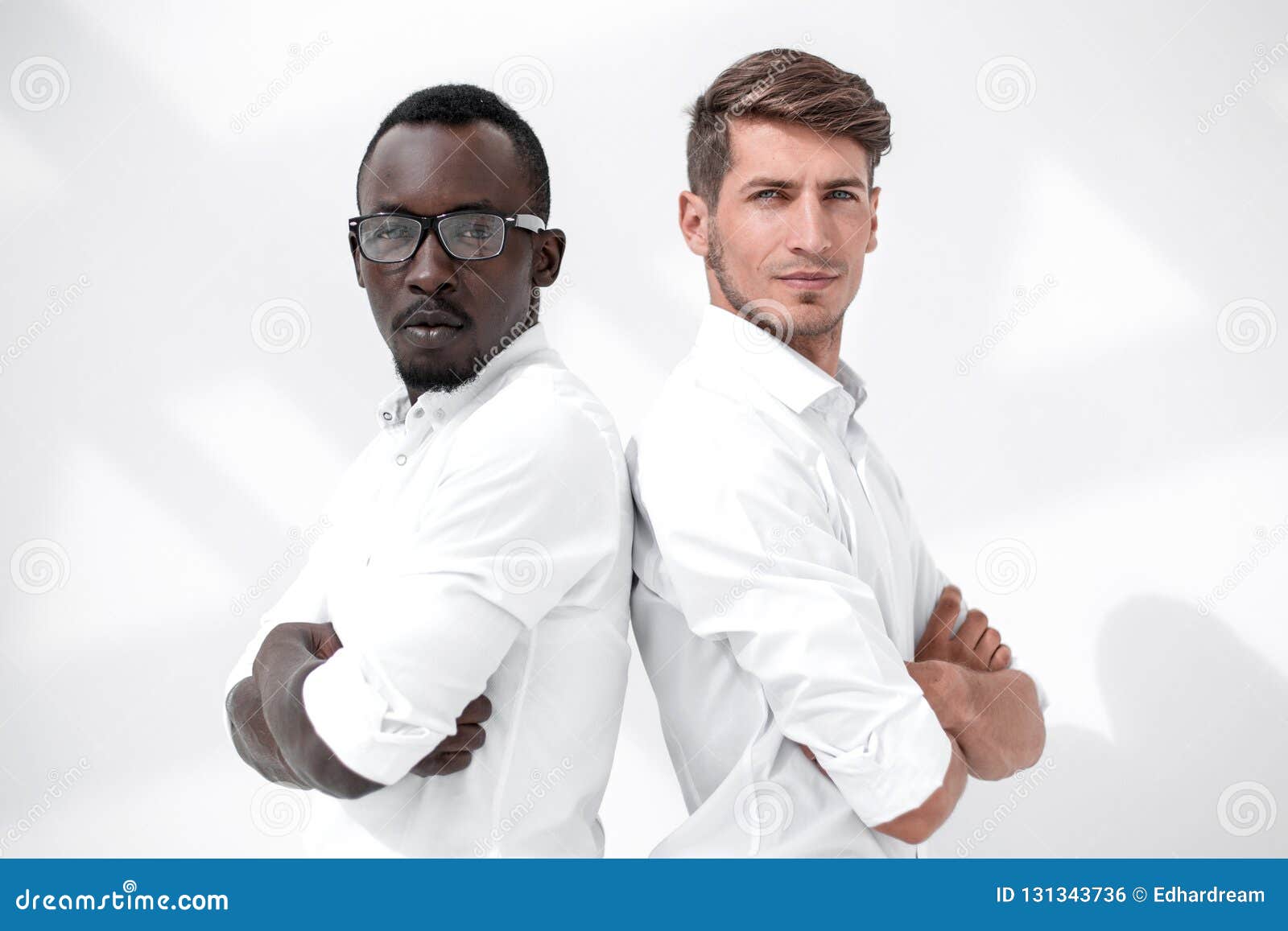 Two Young Business Partners Standing Back To Back Stock Photo - Image ...