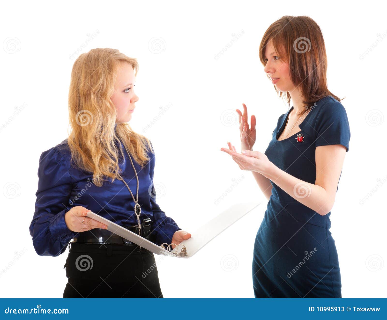 Two Young Business Women Discussing Documents Stock Image - Image of ...