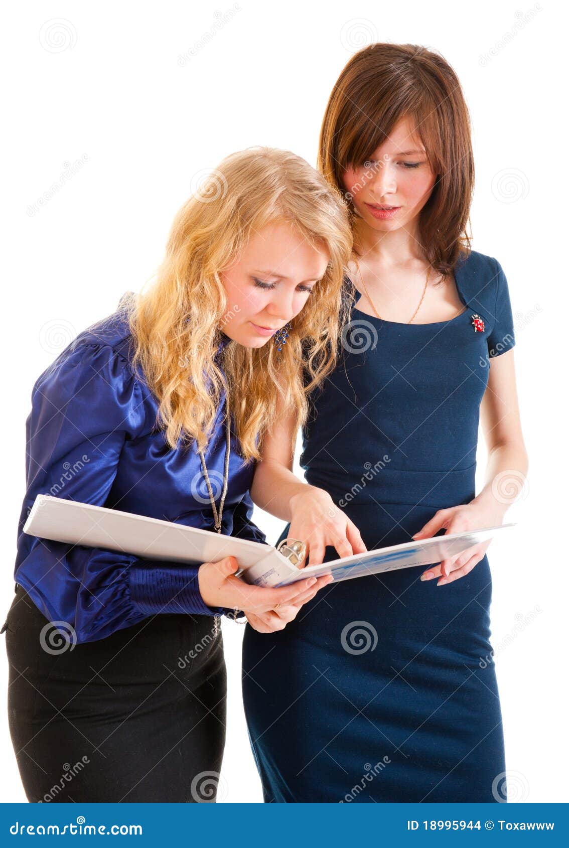 Two Young Business Women Discussing Documents Stock Photo - Image of ...