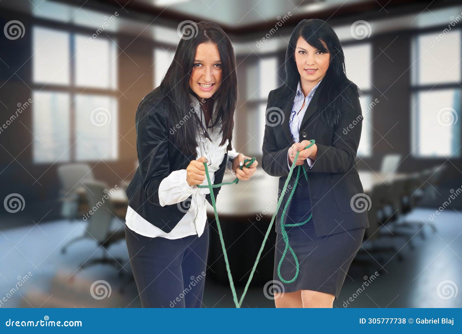 Two Young Business Women Pull the Problems Stock Photo - Image of women ...